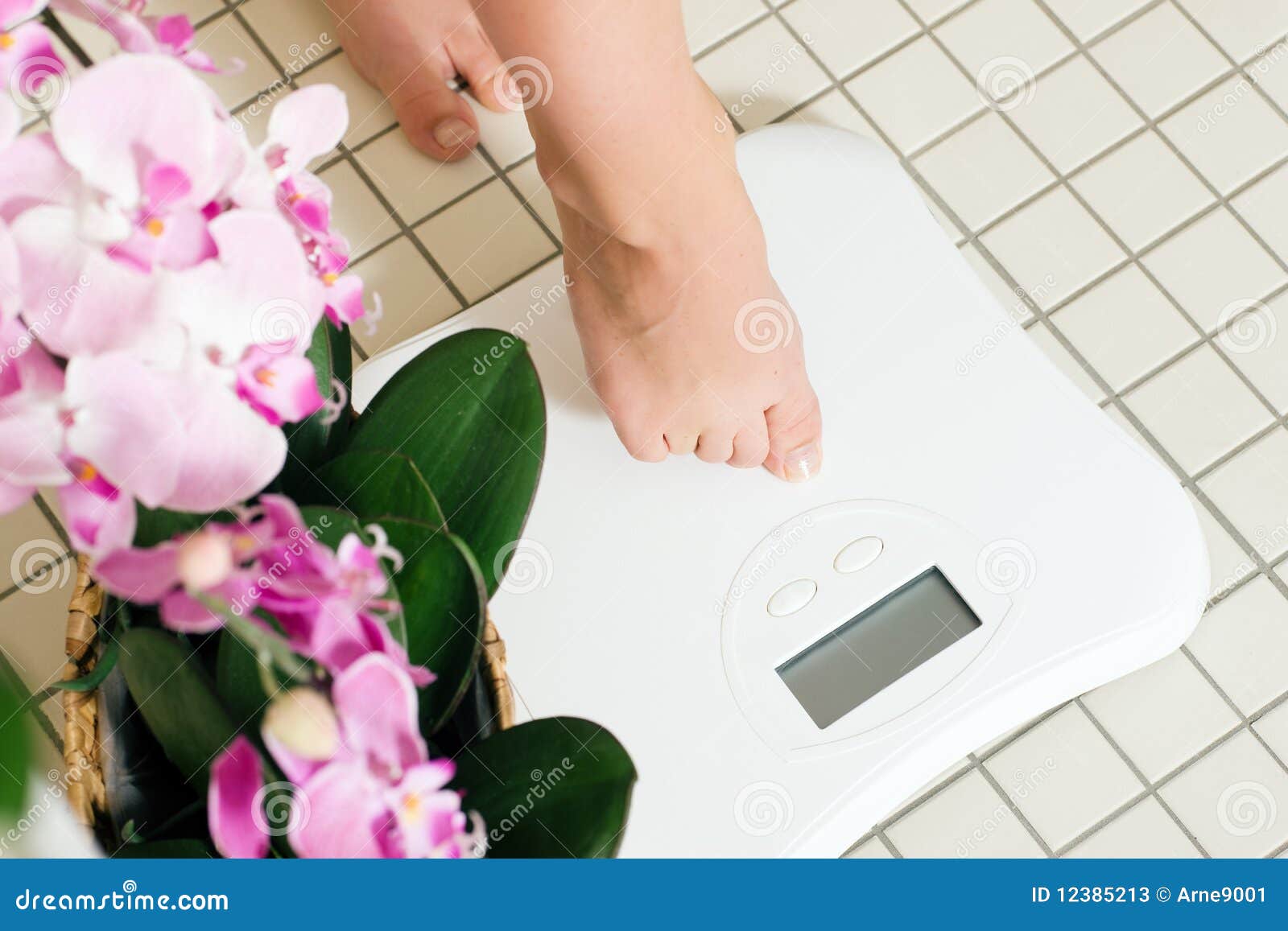 Woman stepping on scale stock image. Image of loss, weight - 12385213