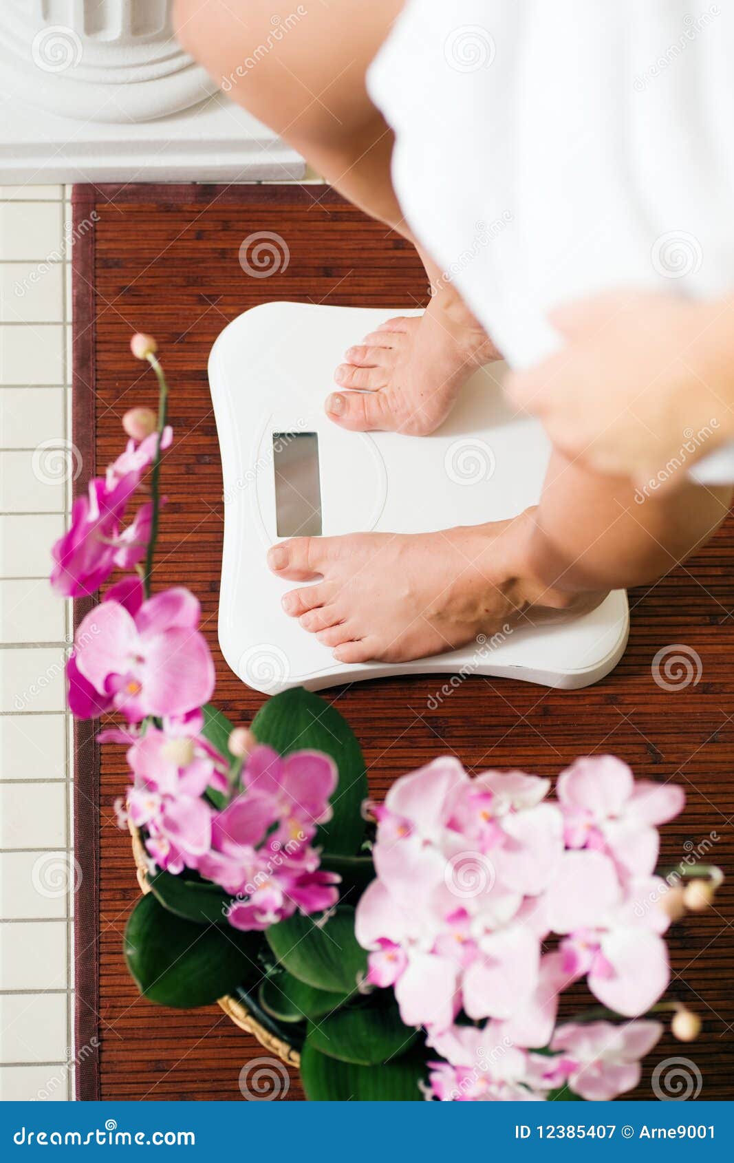 Woman stepping on scale stock image. Image of wellbeing - 12385407