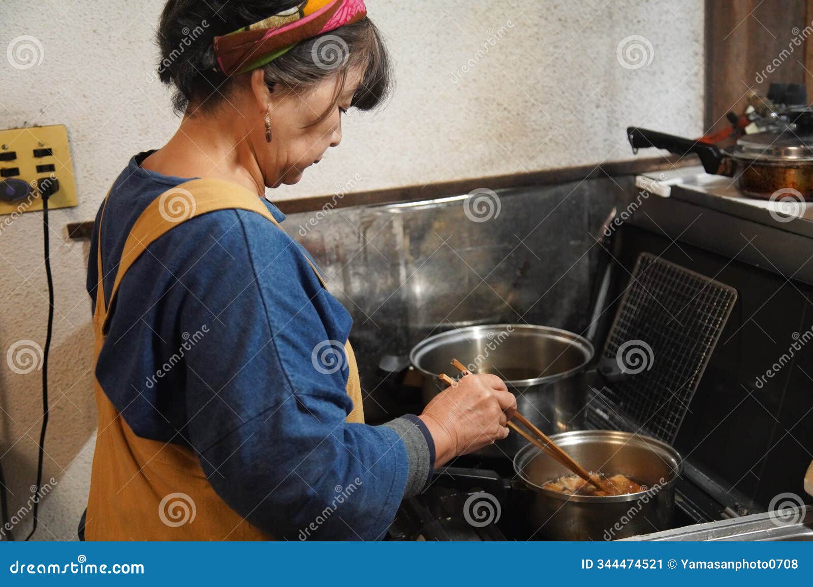 Woman stewing pork belly stock image. Image of soba - 344474521