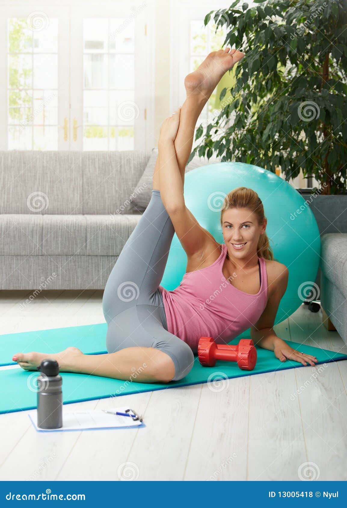 Woman streching her leg stock photo. Image of dumbbell - 13005418