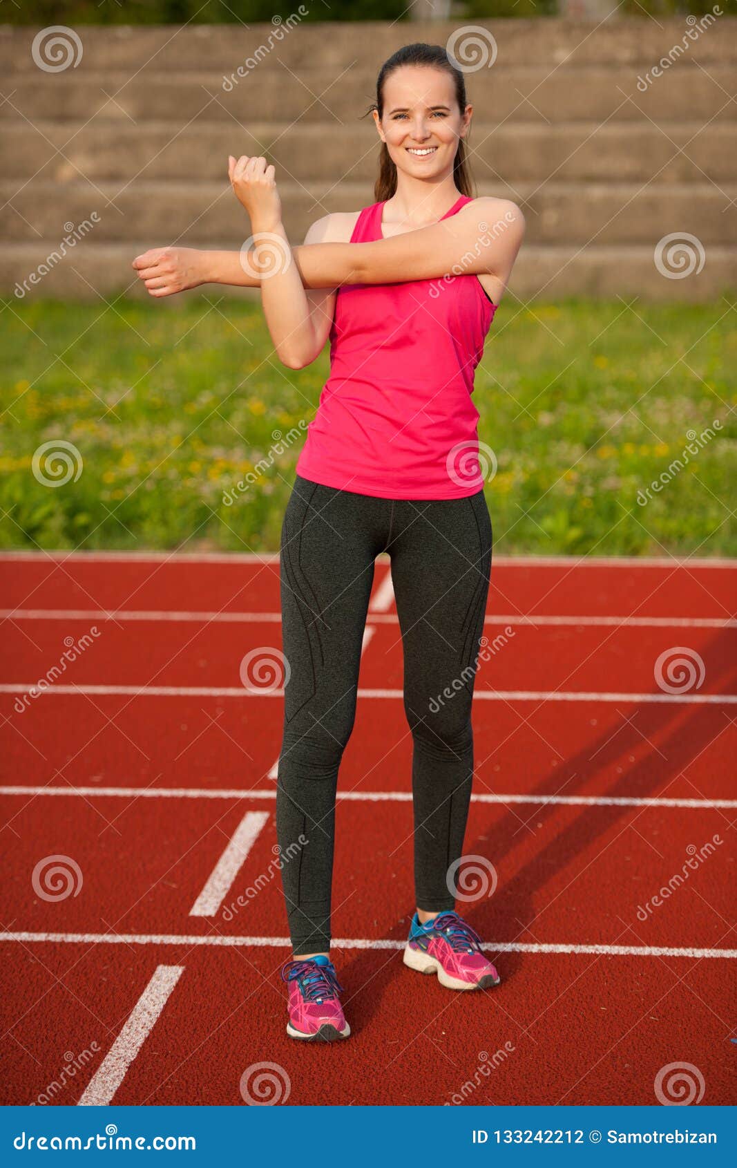 Woman Stretch Arms on Athletic Track Stock Photo - Image of arms ...