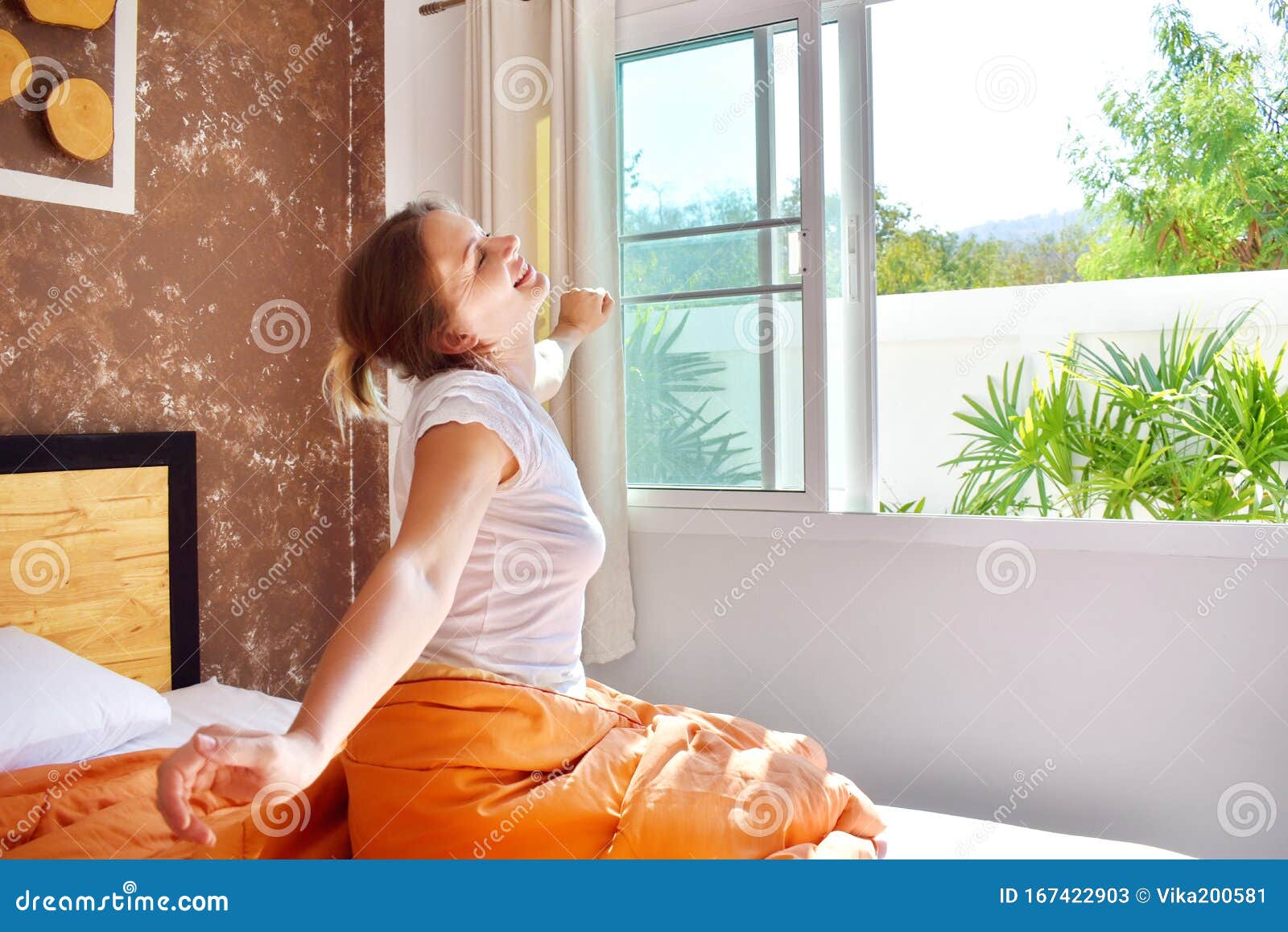 Girl Wakes Up In The Morning In Bed Beautiful Sunny Morning Waking Up
