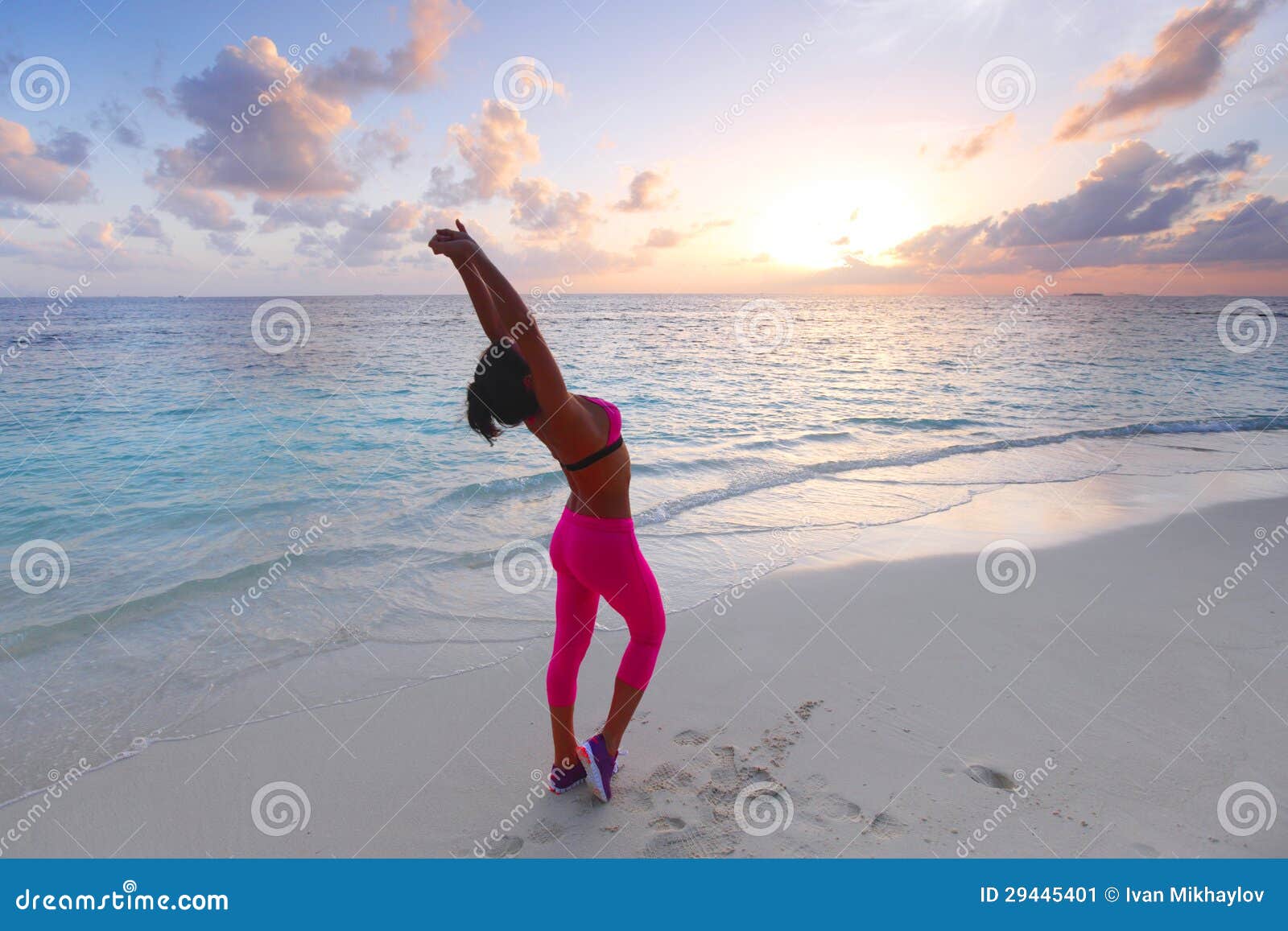 Woman stretching on beach stock image. Image of morning - 29445401