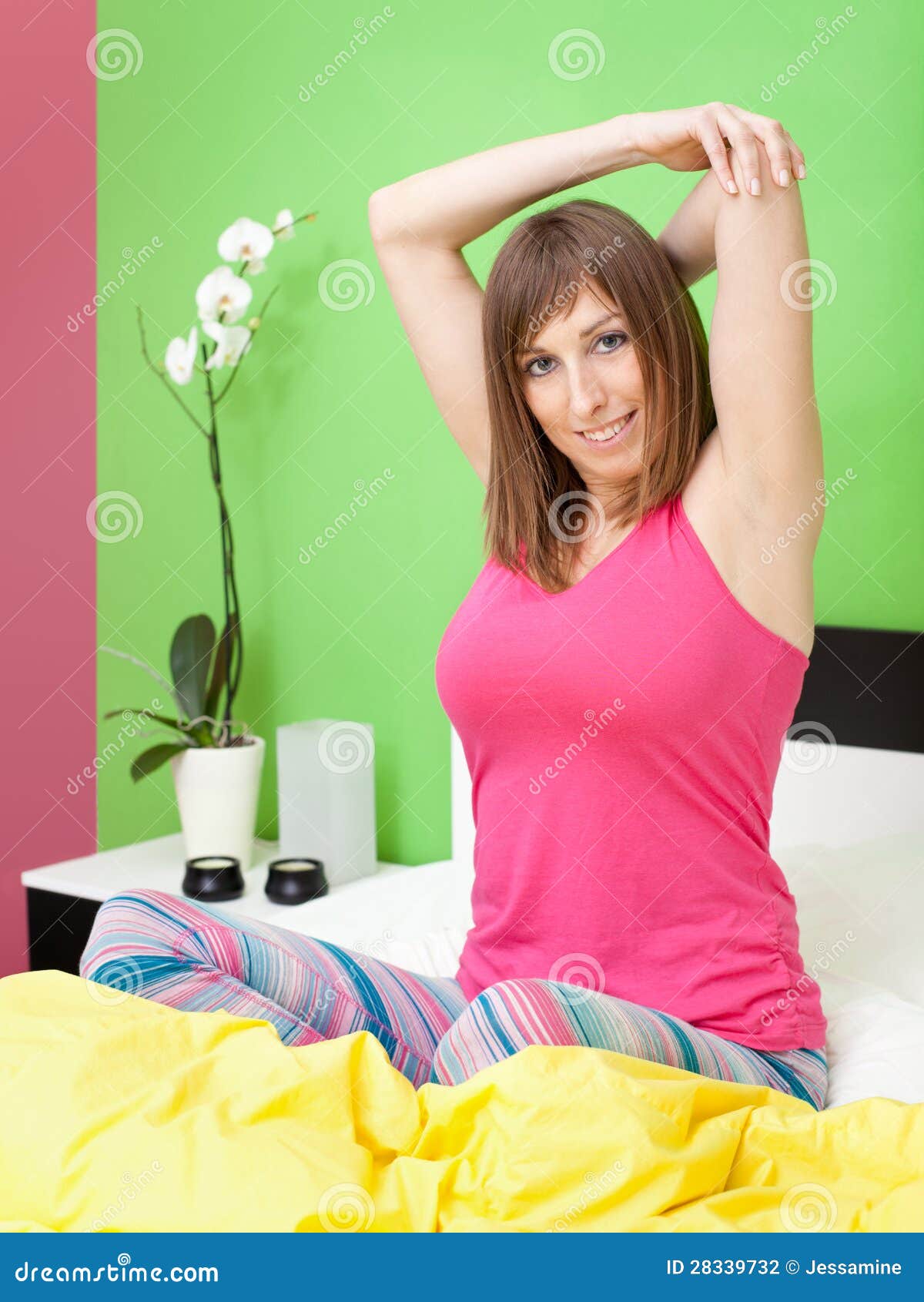 Woman stretching in bed stock photo. Image of excercise - 28339732