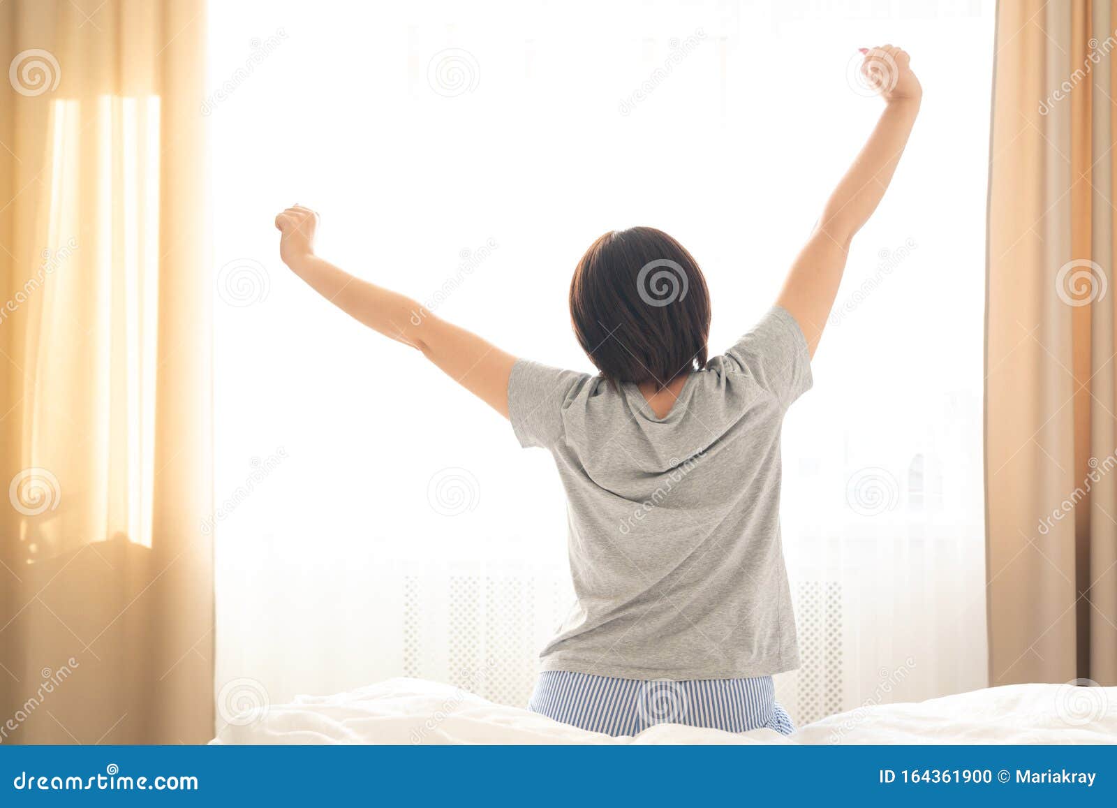 Woman Stretching in Bed after Wake Up, Back View Stock Photo - Image of ...