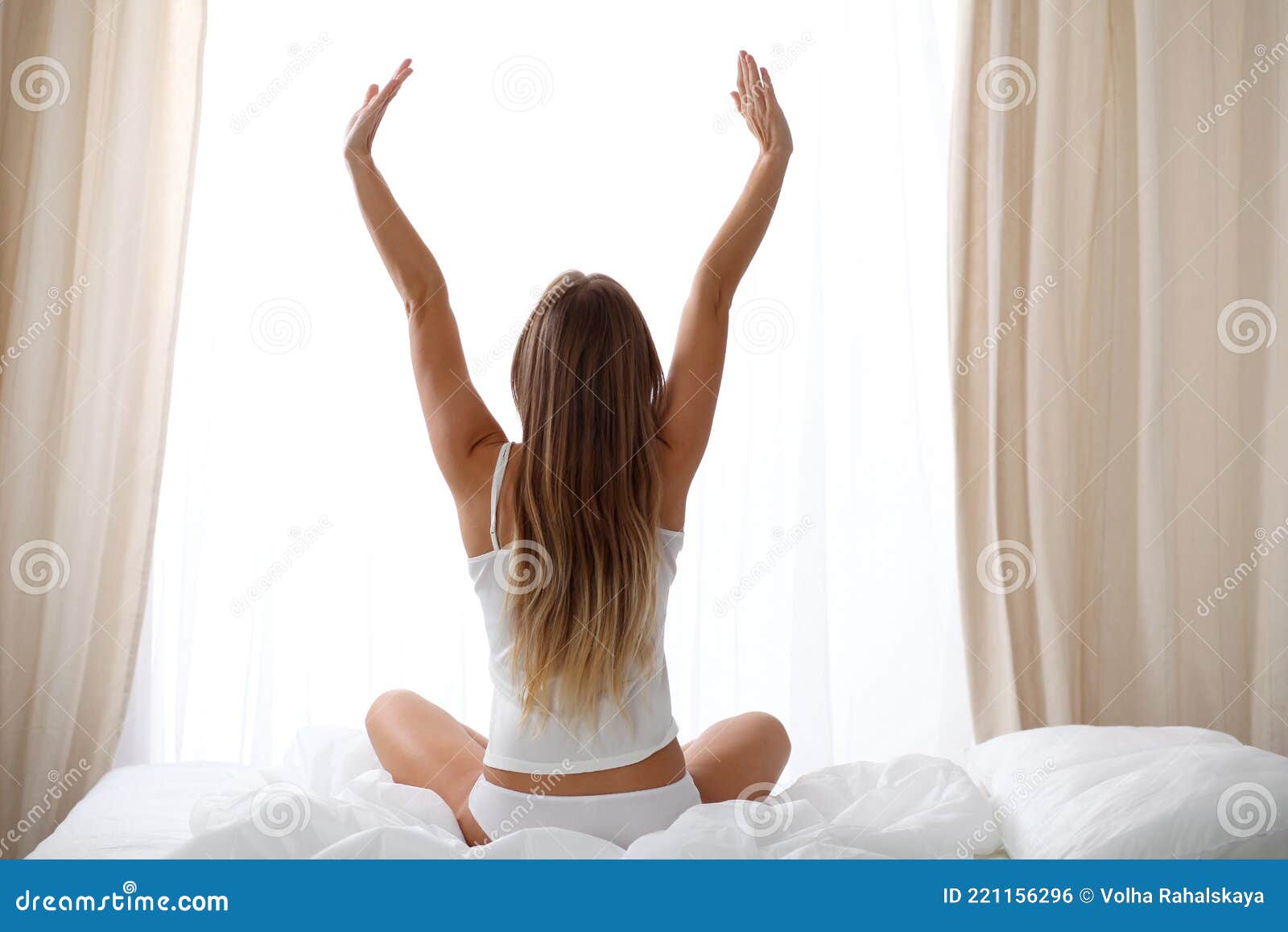 Woman Stretching In Bed After Wake Up Back View Entering A Day Happy
