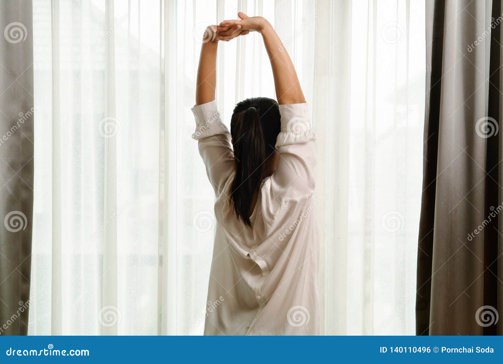 Woman Stretching in Bedroom after Wake Up, Back View Stock Photo ...
