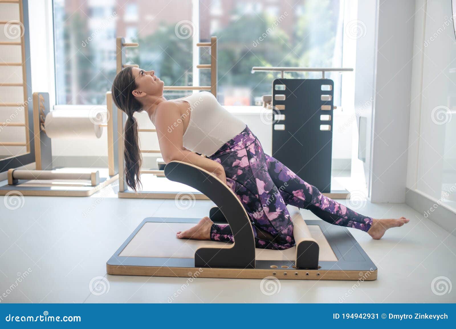 Woman Stretching Her Back Muscles in a Gym Stock Image - Image of ...