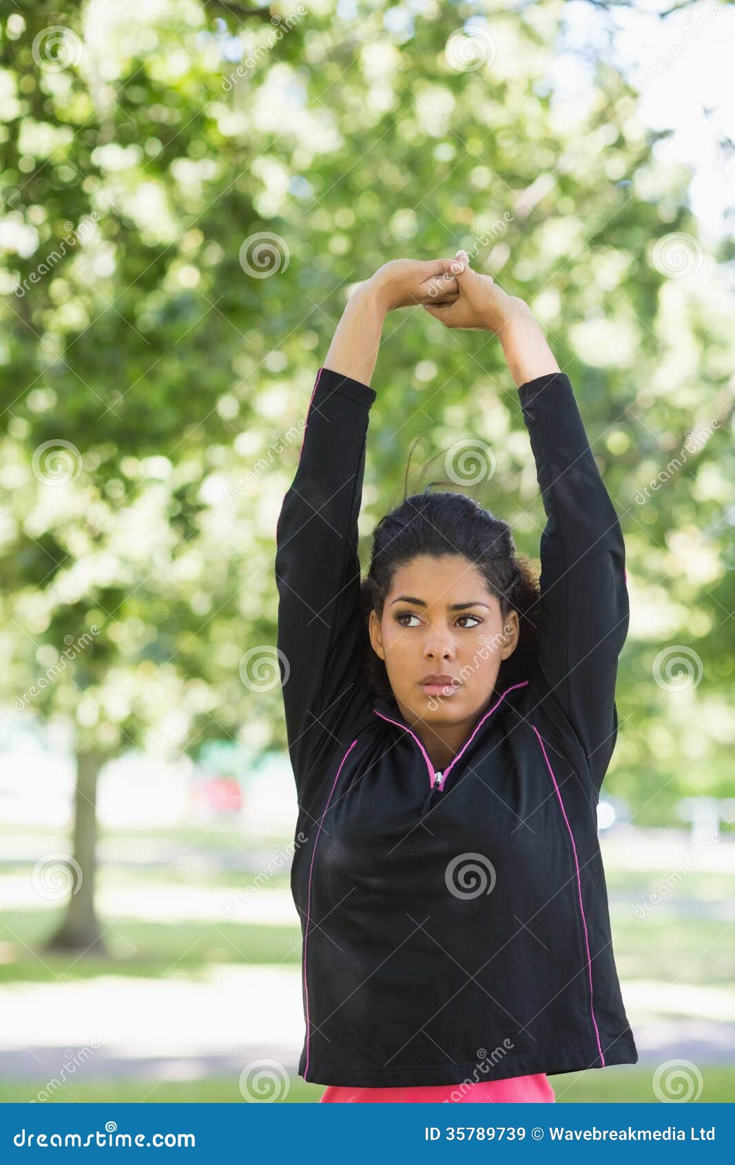 Woman Stretching Her Hands during Exercise at Park Stock Image - Image ...