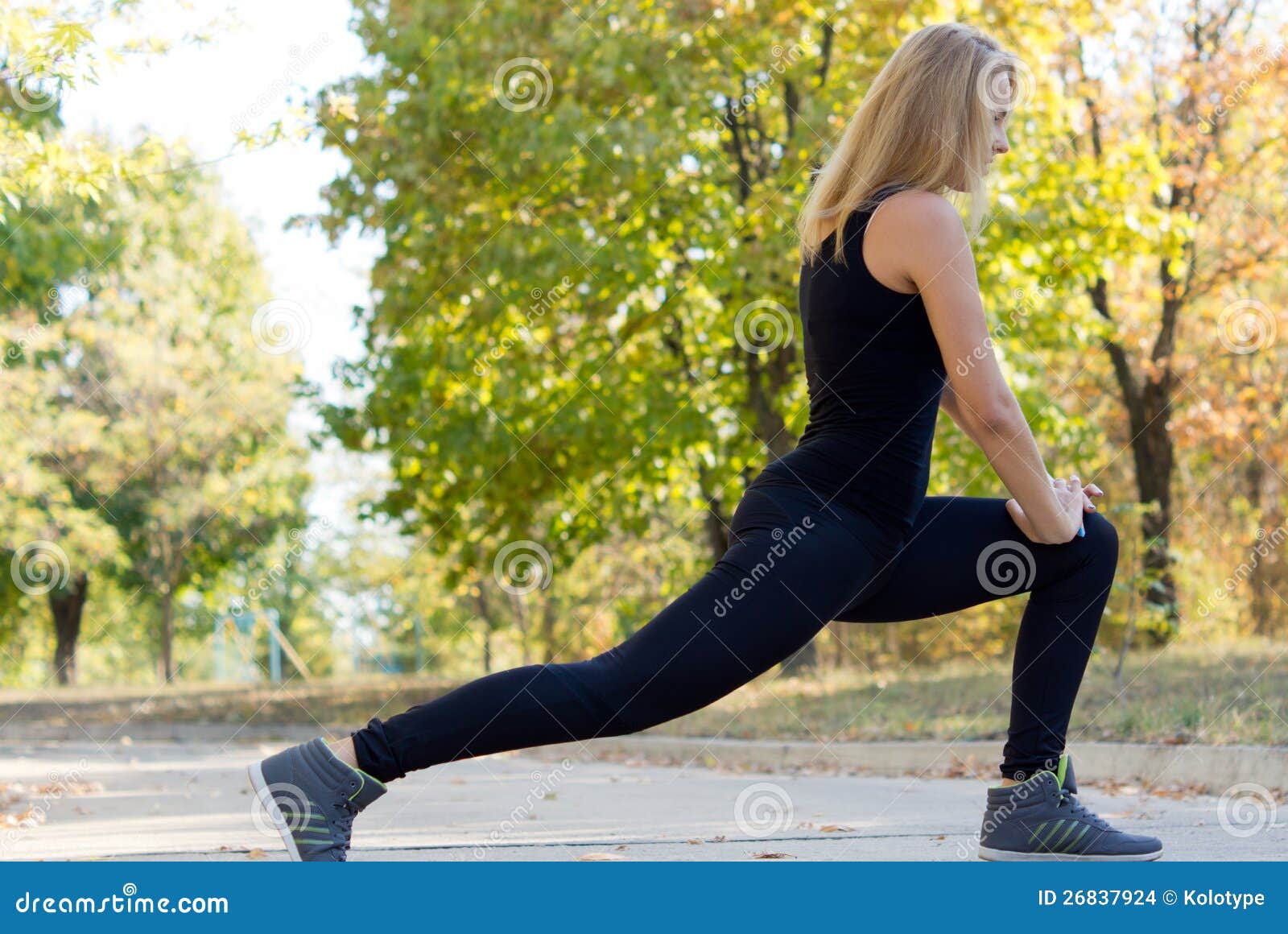 Woman Stretching during a Workout Stock Photo - Image of supple, sporty ...