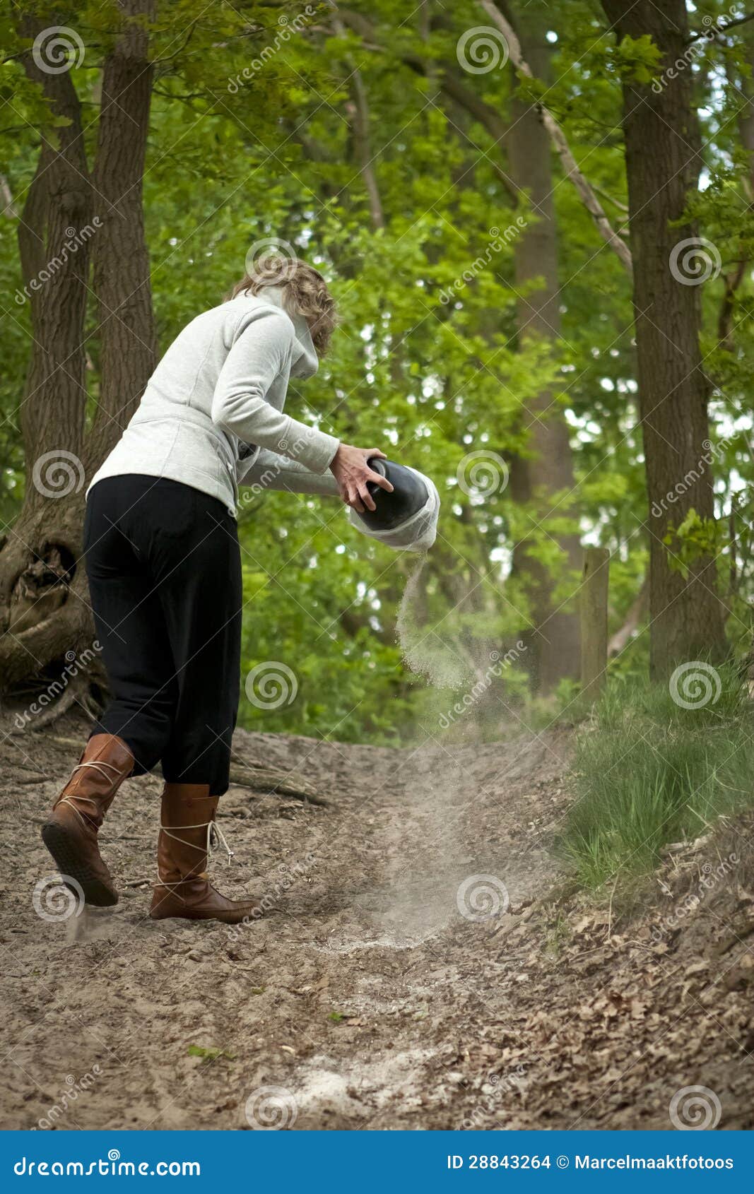 Woman strewing ashes stock photo. Image of scattering - 28843264