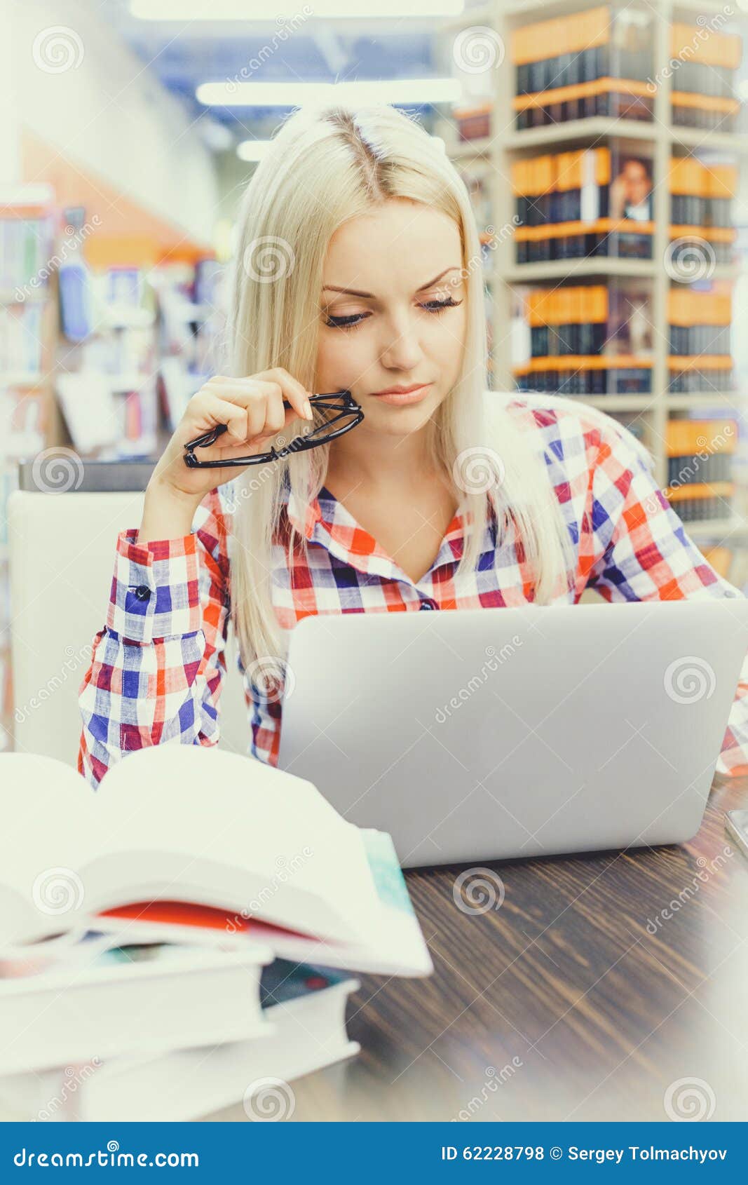 Woman studying in library stock photo. Image of library - 62228798
