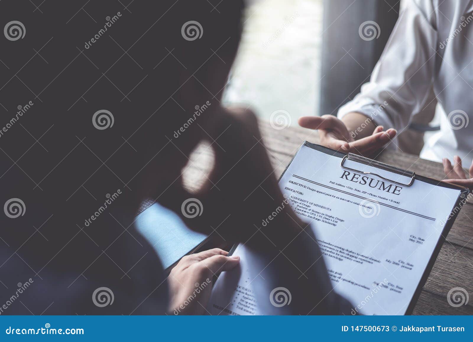 Woman Submits Job Application, Interviewer Reading a Resume Stock Image ...