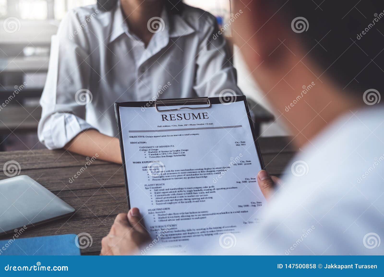 Woman Submits Job Application, Interviewer Reading a Resume Stock Photo ...