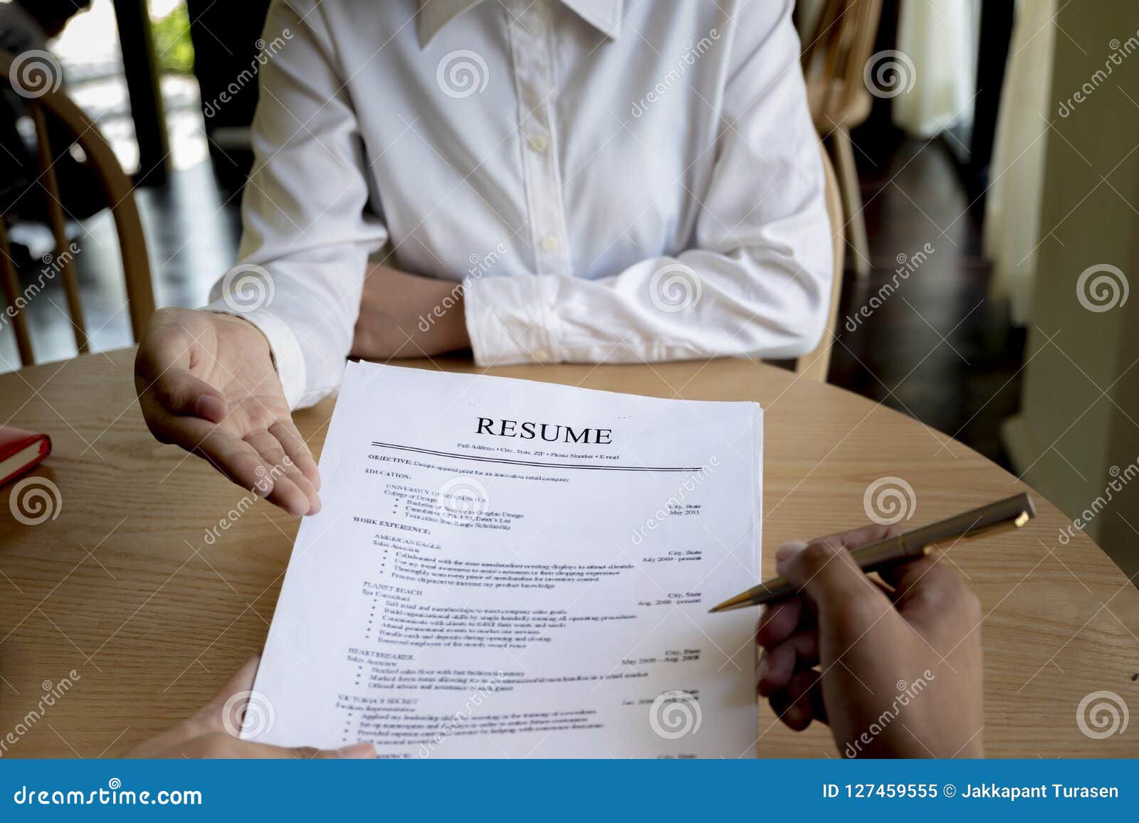 Woman Submits Job Application, Interviewer Reading a Resume. Stock ...