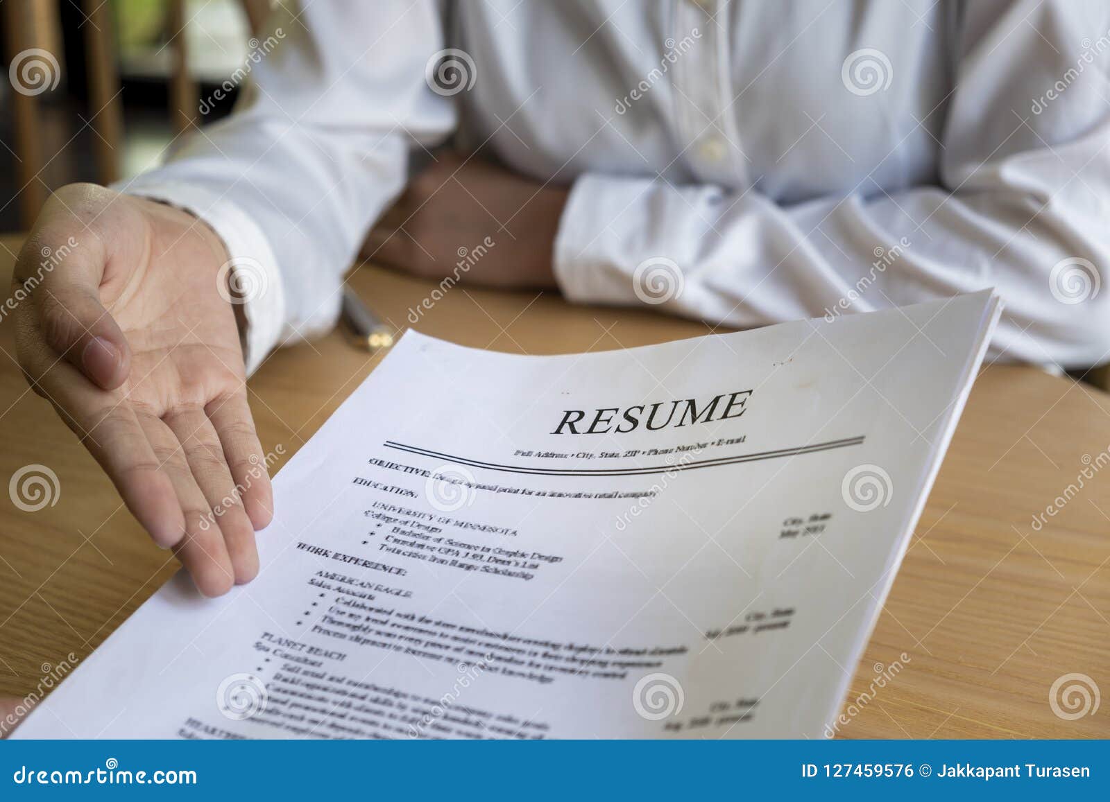 Woman Submits Job Application, Interviewer Reading a Resume. Stock ...
