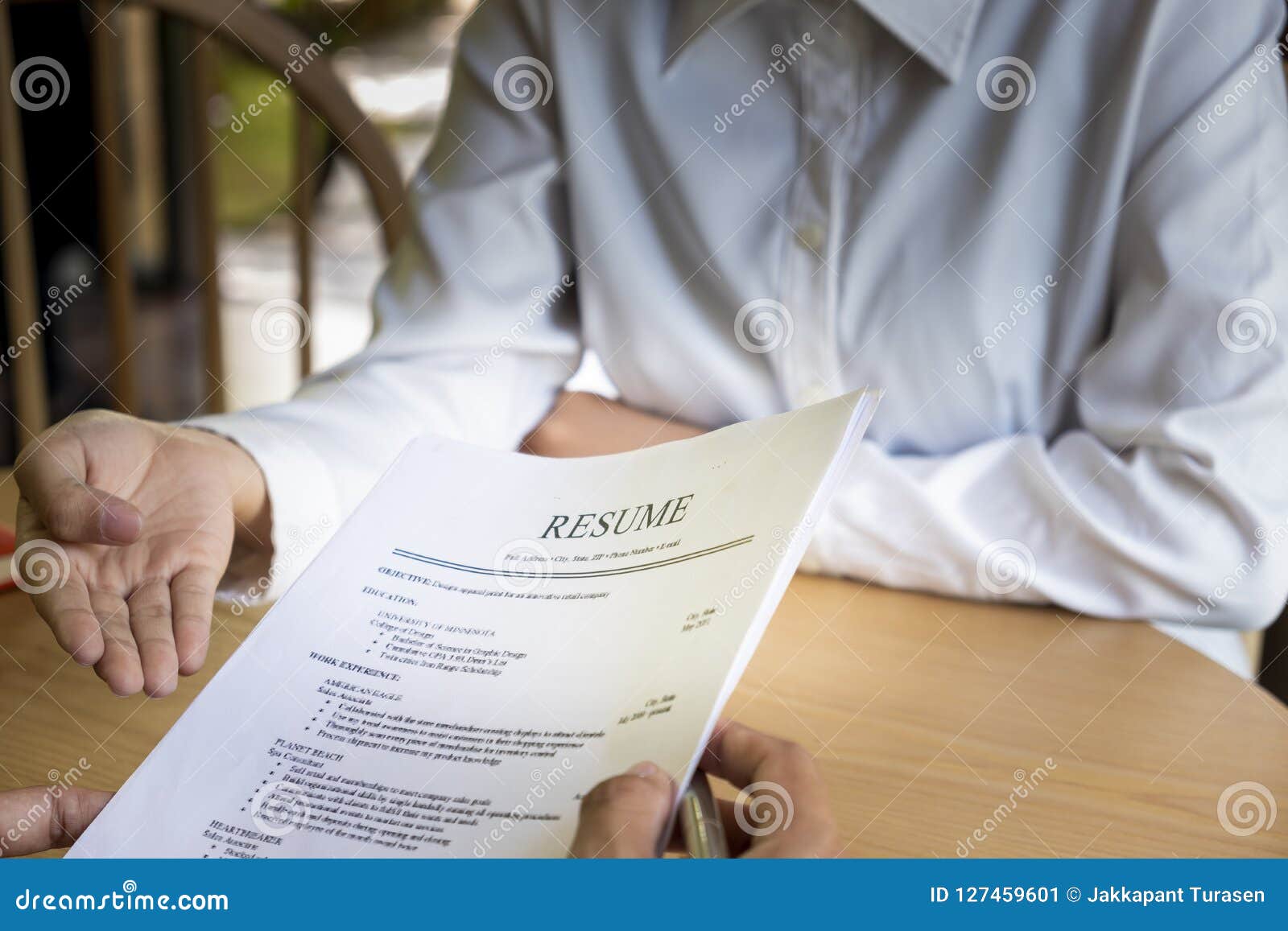 Woman Submits Job Application, Interviewer Reading a Resume. Stock ...