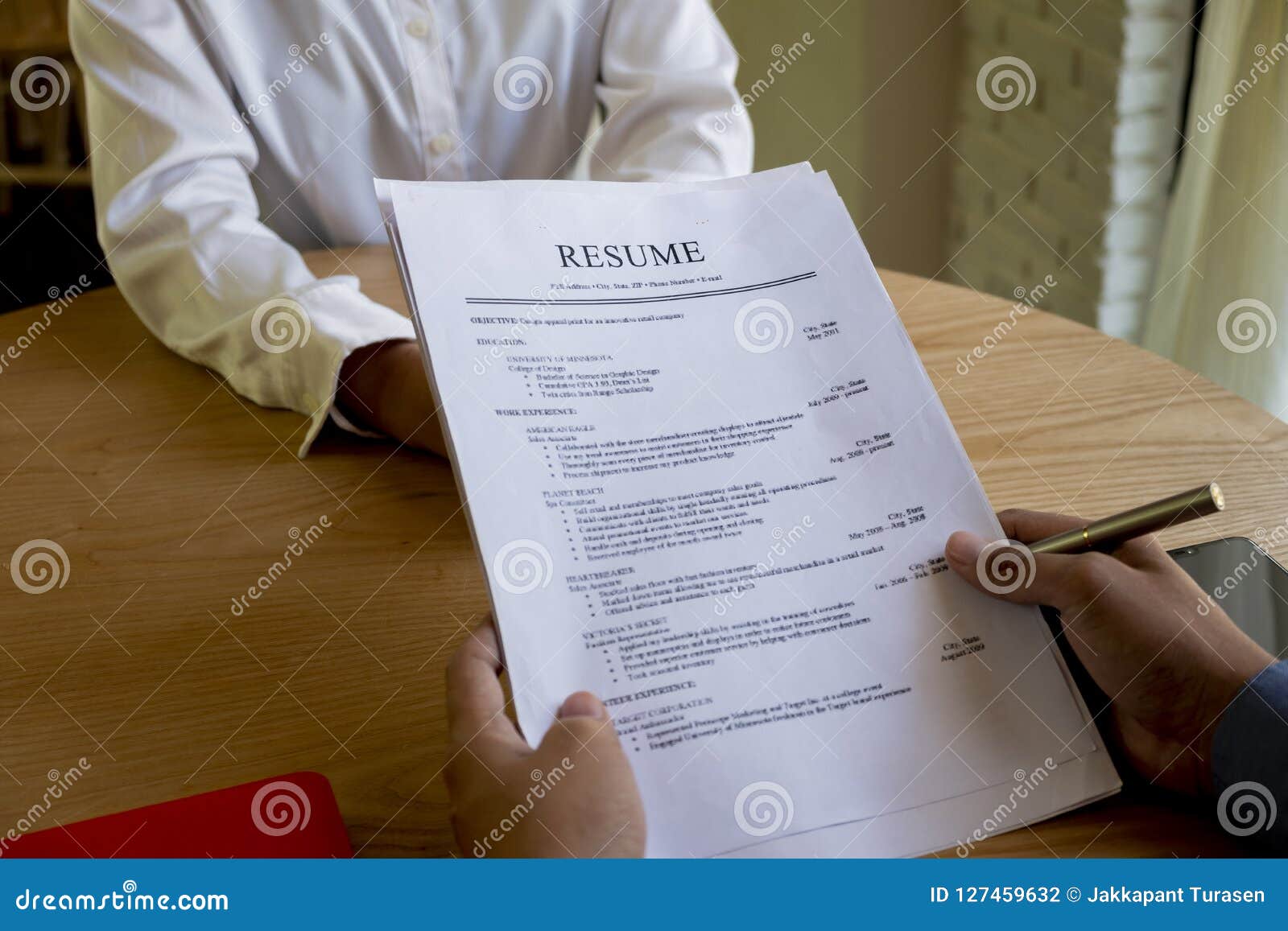 Woman Submits Job Application, Interviewer Reading a Resume. Stock ...