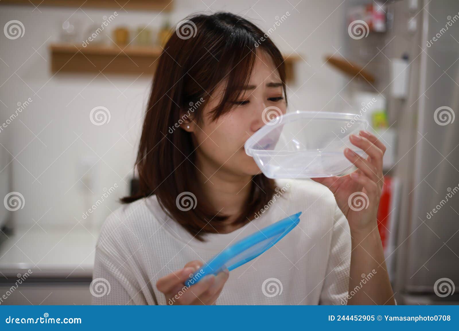A Woman Suffering from the Smell of a Storage Container Stock Image ...