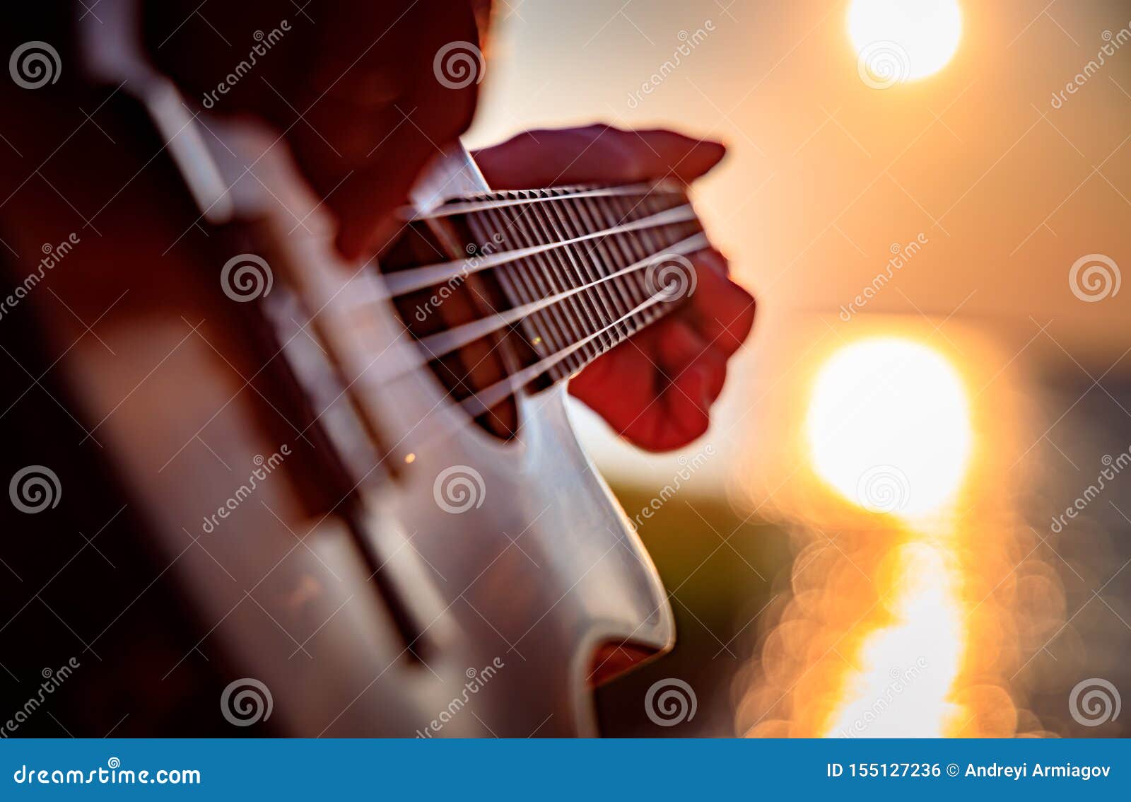 Woman at Sunset Playing the Ukulele Stock Photo - Image of background ...