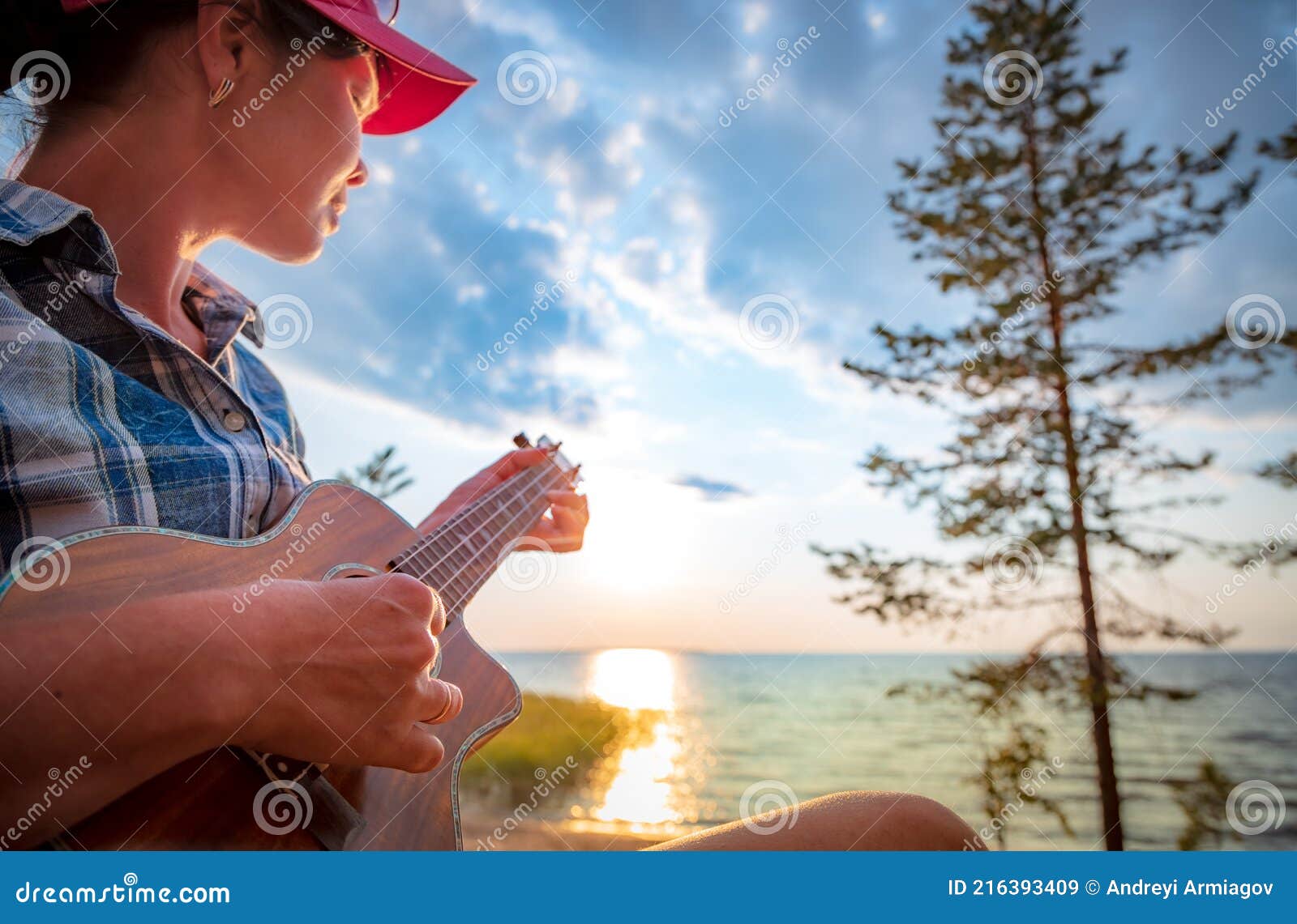 Woman at Sunset Playing the Ukulele Stock Image - Image of cover, dream ...