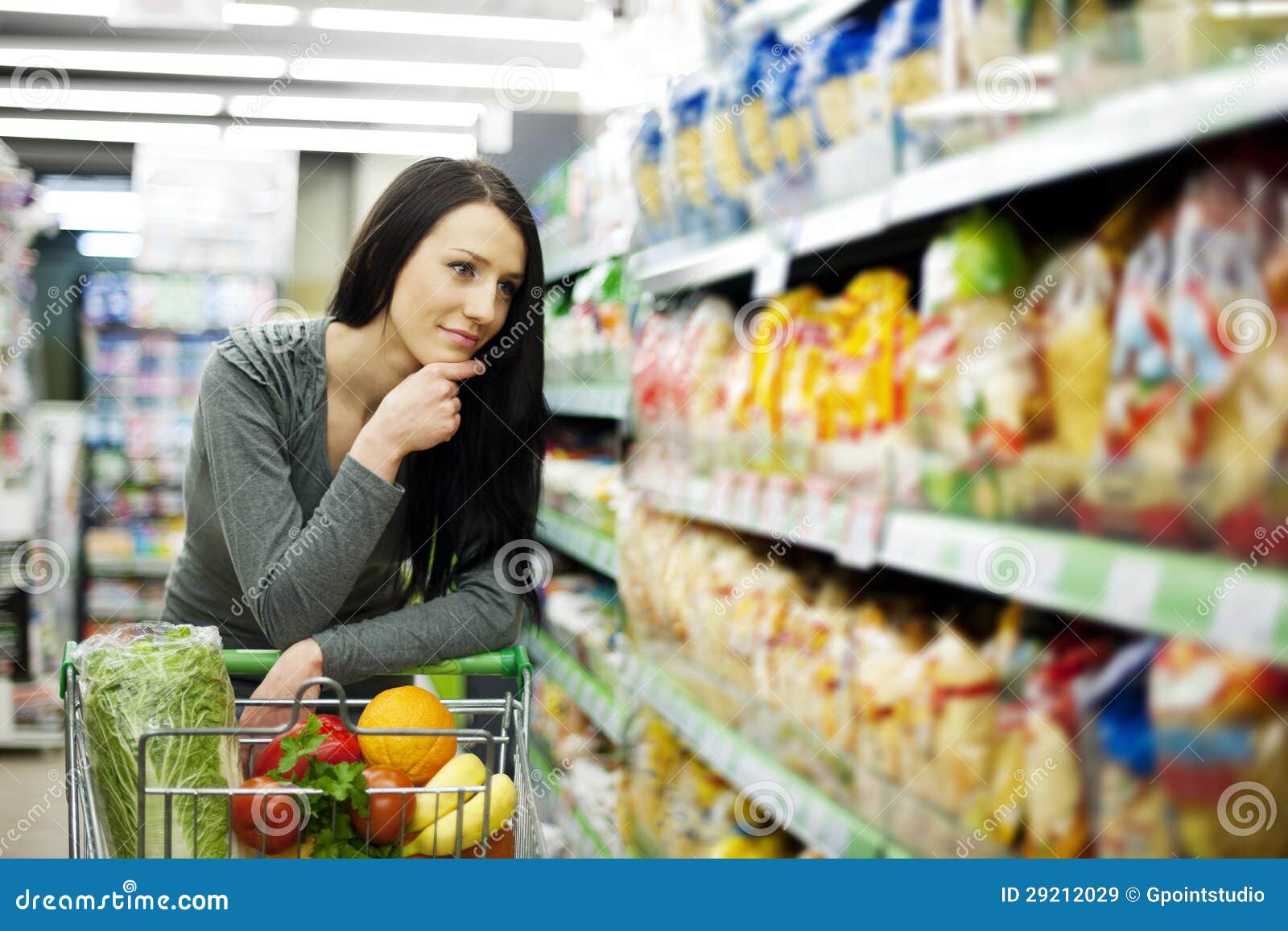 Woman in supermarket stock image. Image of examining - 29212029