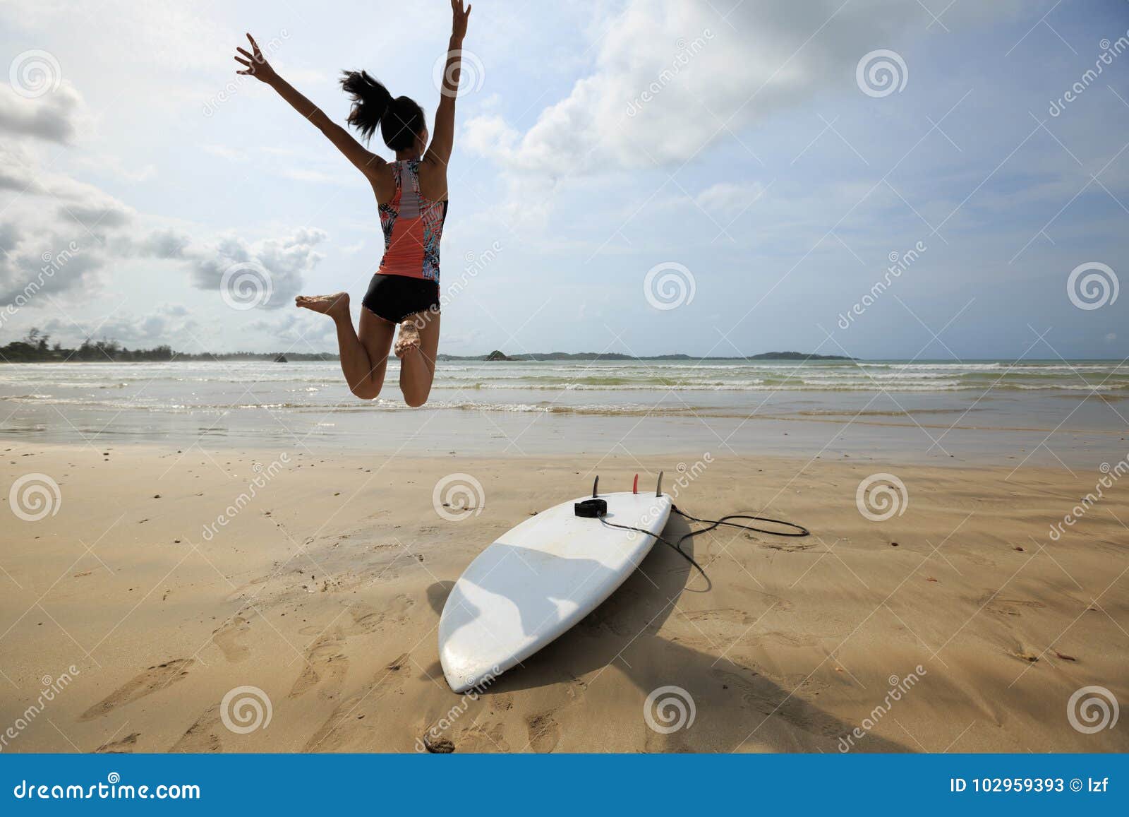 Woman surfer jumping stock image. Image of rashguard - 102959393