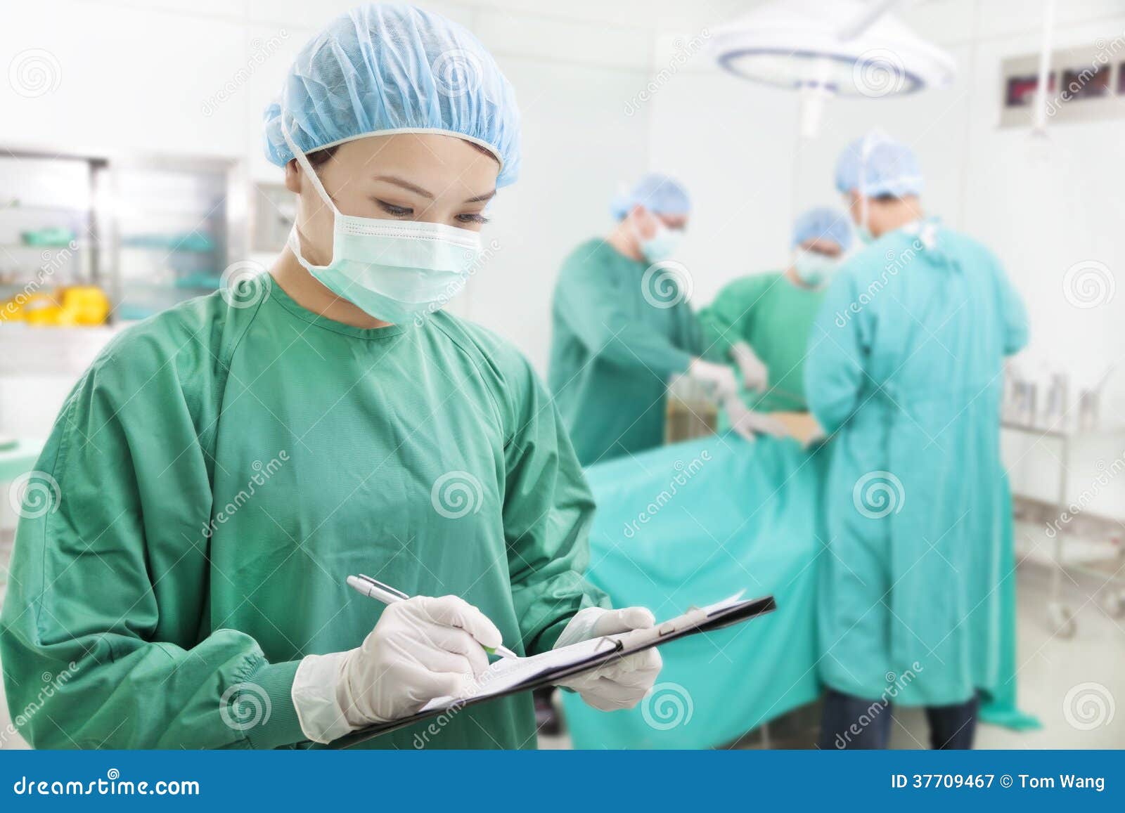 Woman Surgeons Writing Records on Form Stock Image - Image of doctor ...