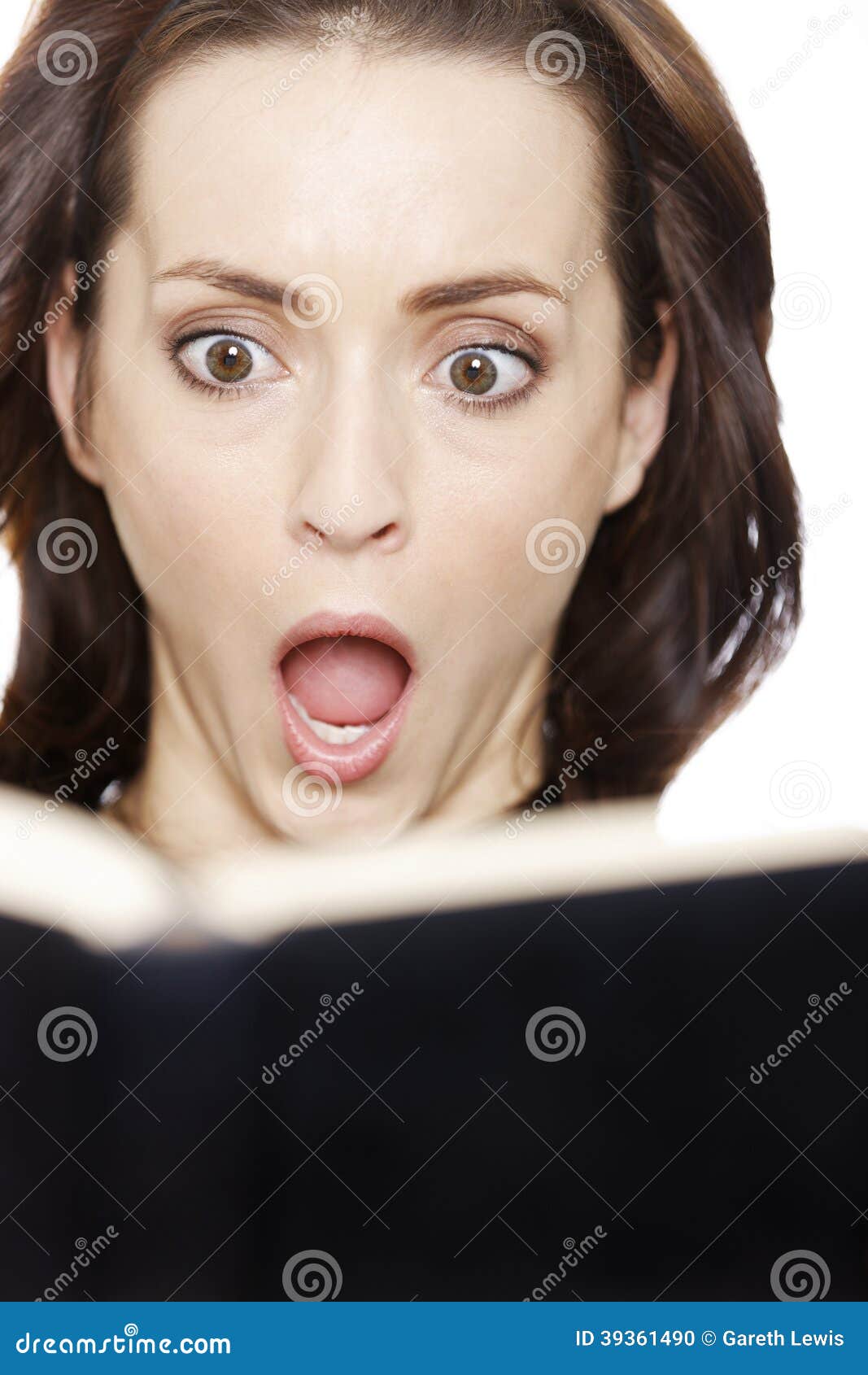 Woman surprised by book stock photo. Image of female - 39361490