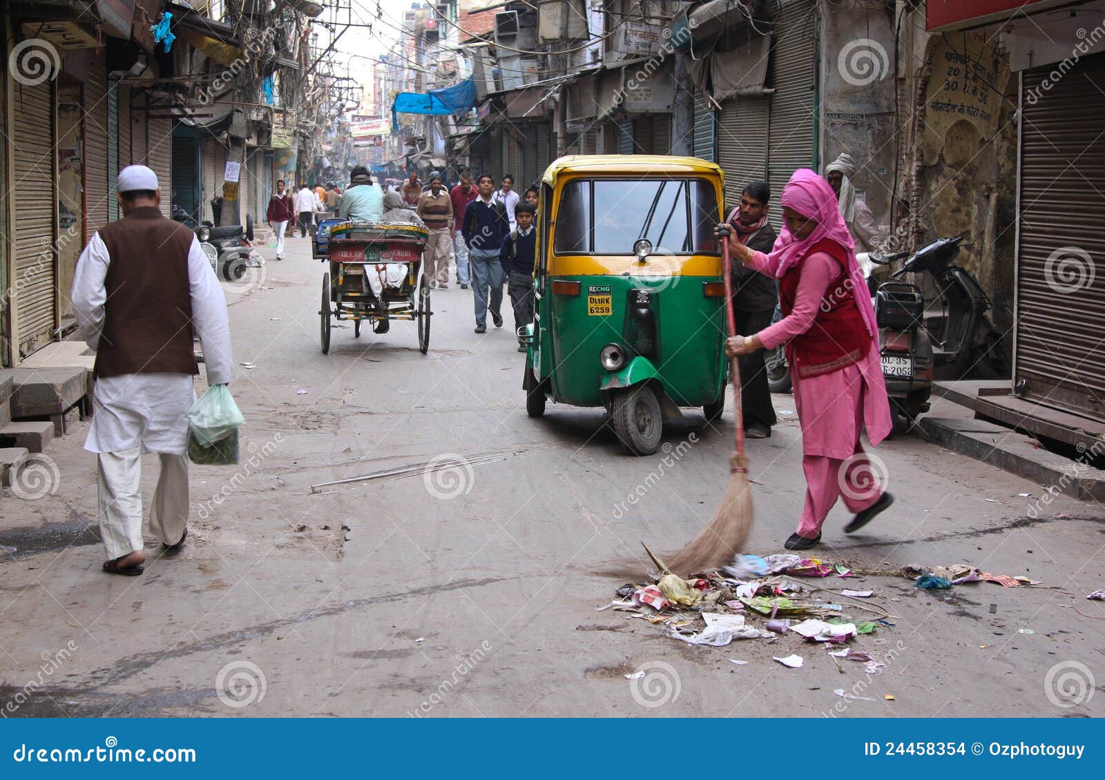 Woman Sweeping Garbage Into A Plastic Dustpan Stock Photo ...