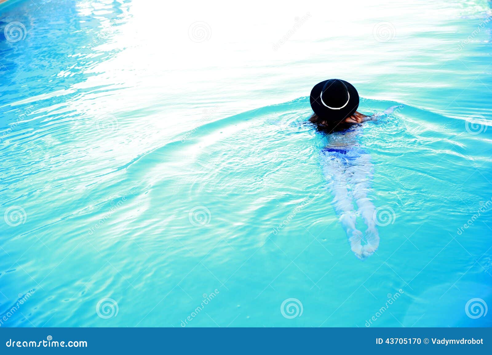 Woman swimming in the pool stock photo. Image of inviting - 43705170
