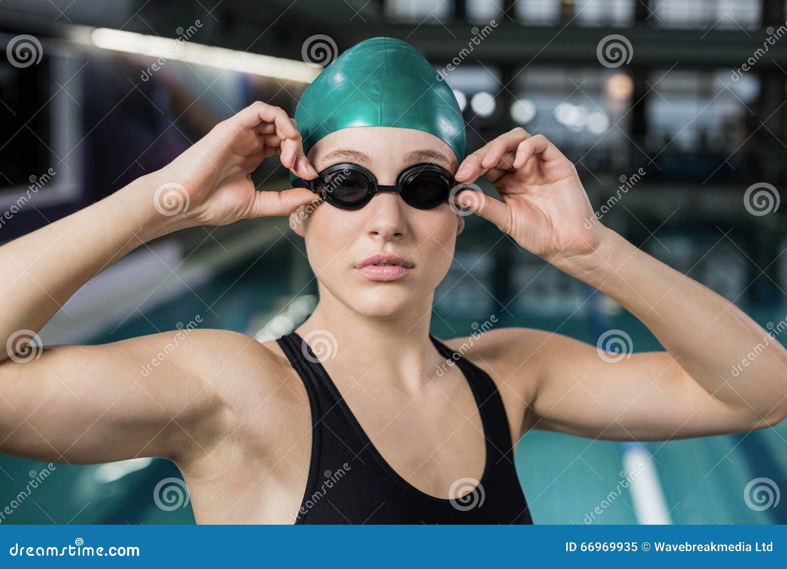 Woman in Swimsuit Adjusting Her Goggles Stock Image - Image of athlete ...
