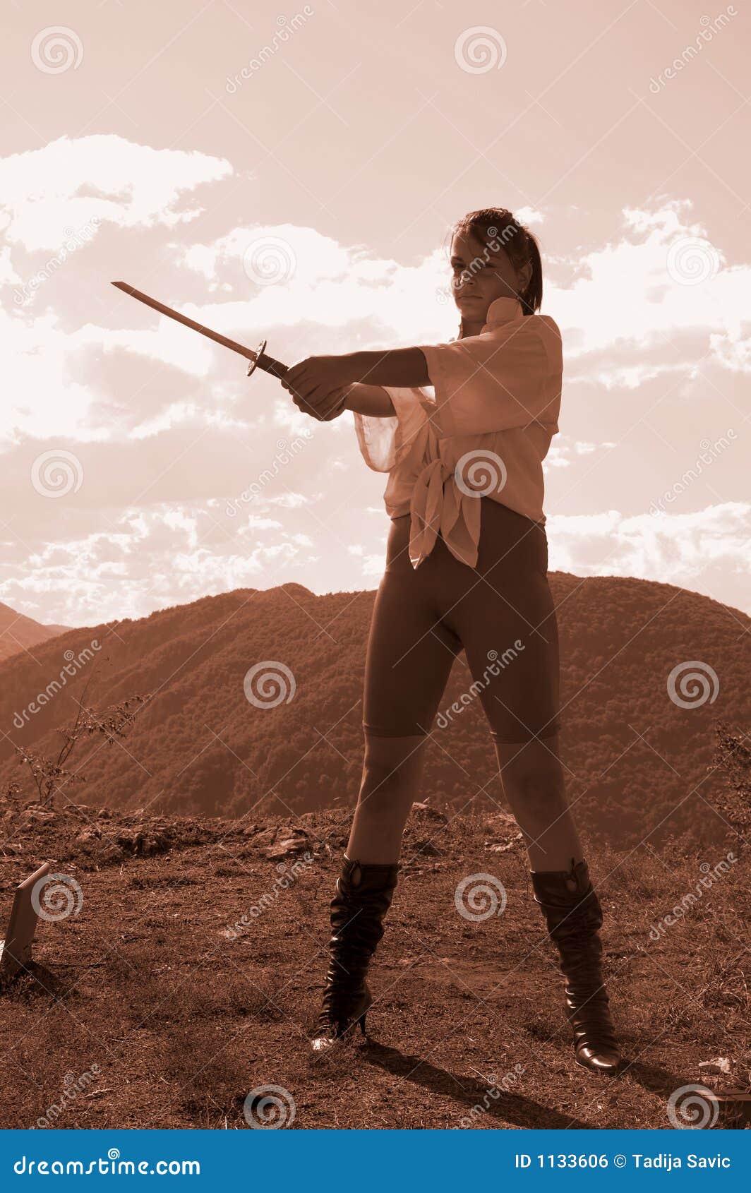 Woman with sword stock photo. Image of mountains, bloodthirsty - 1133606