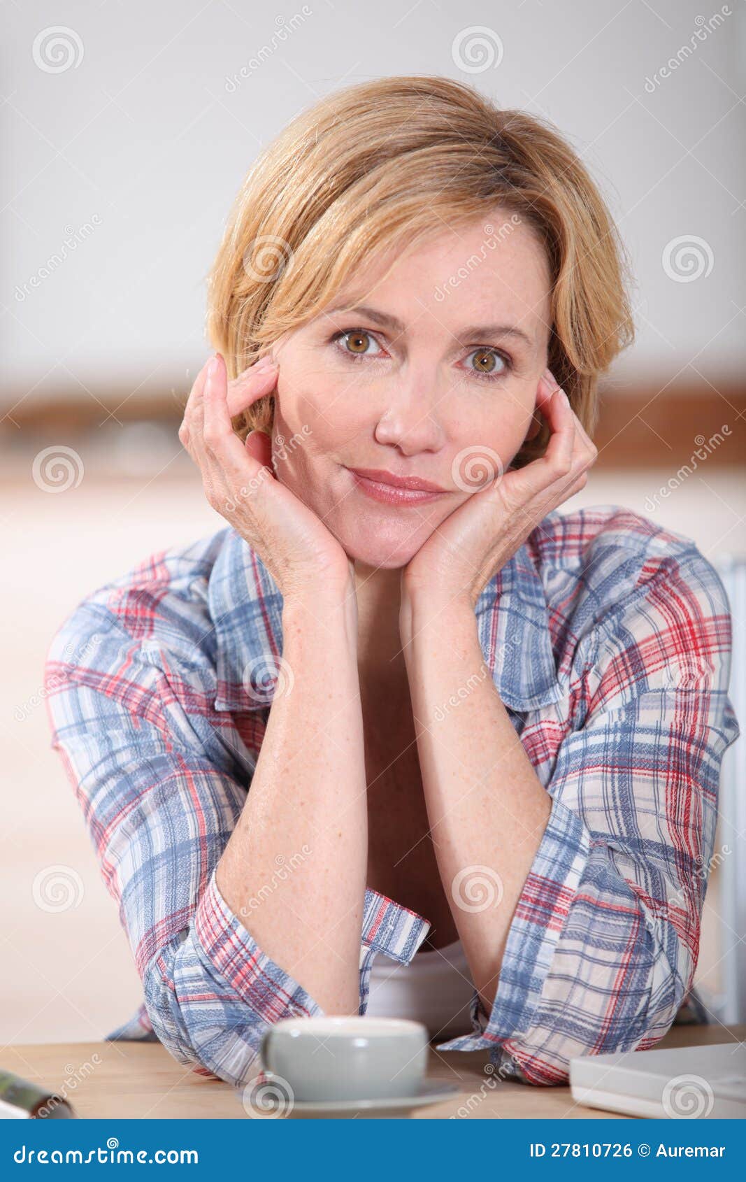 Woman at a table stock photo. Image of holding, table - 27810726