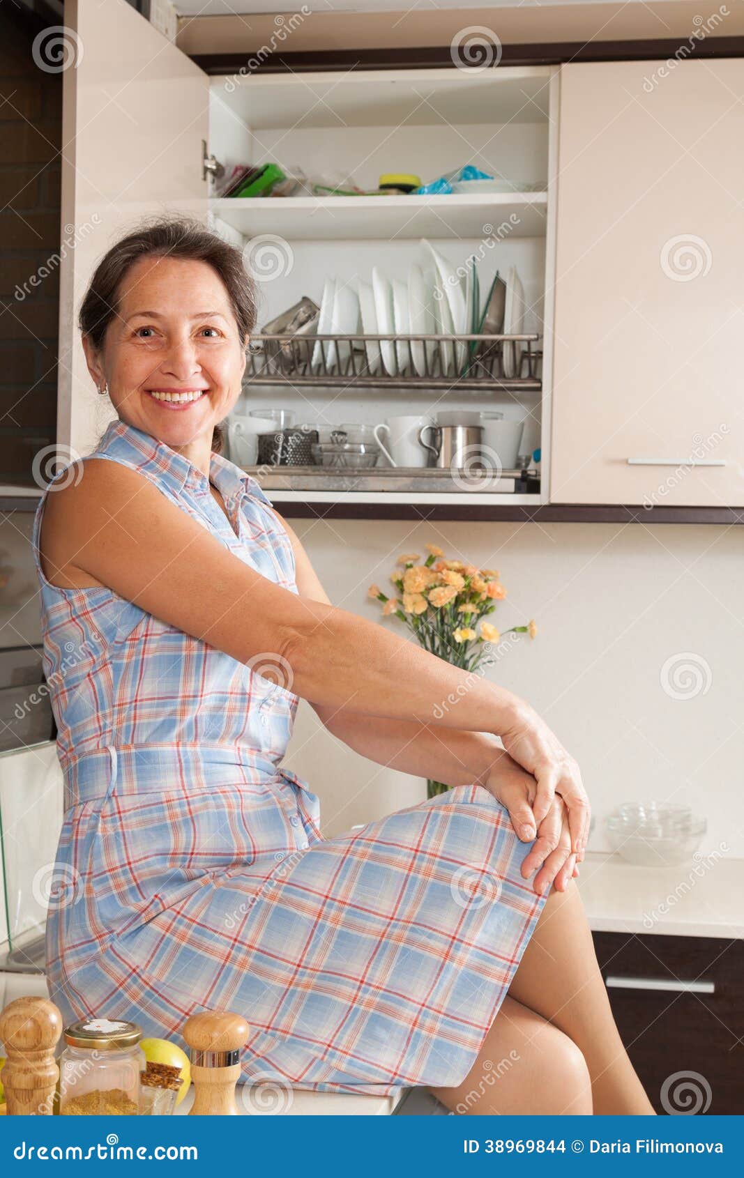 Woman on Table of Domestic Kitchen Stock Photo - Image of confidence ...
