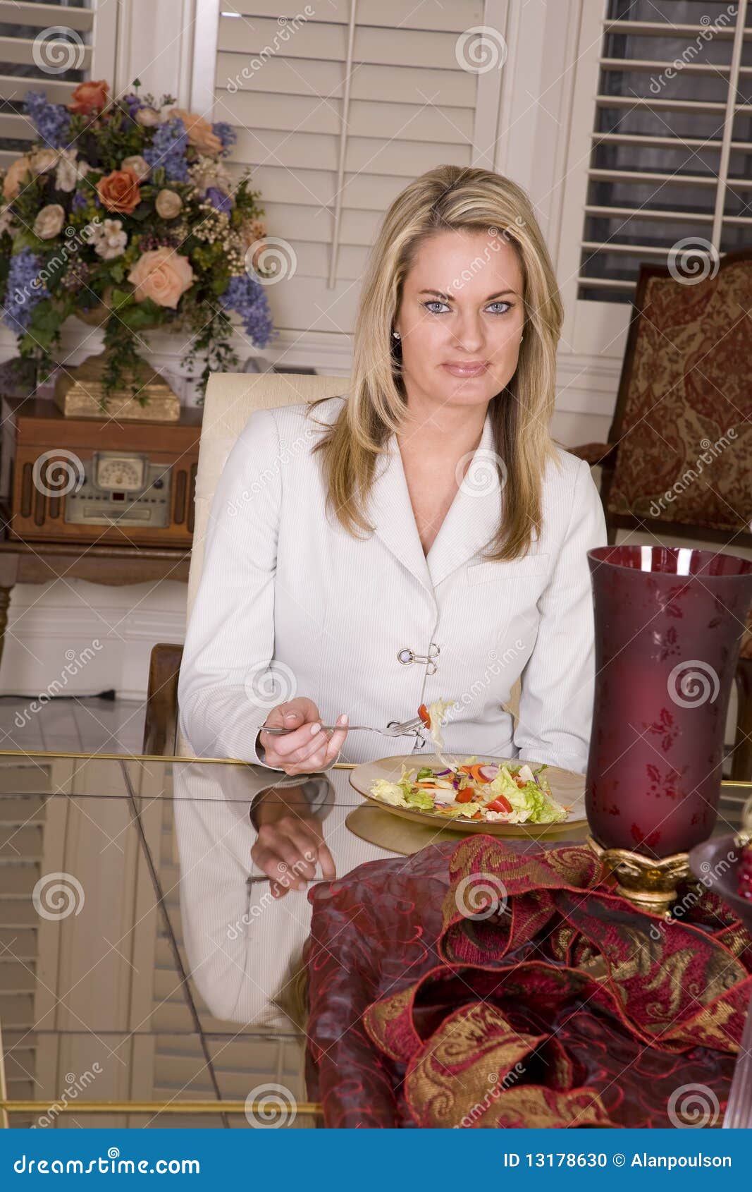 Woman at table eating stock photo. Image of home, fancy - 13178630