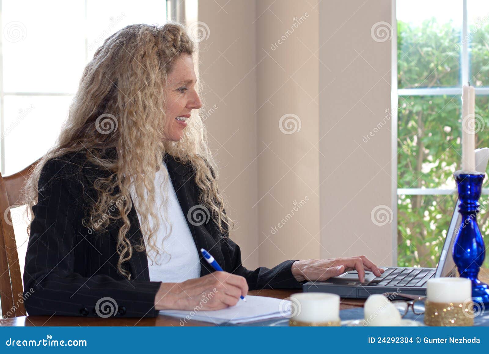 Woman on table with laptop stock photo. Image of cute - 24292304