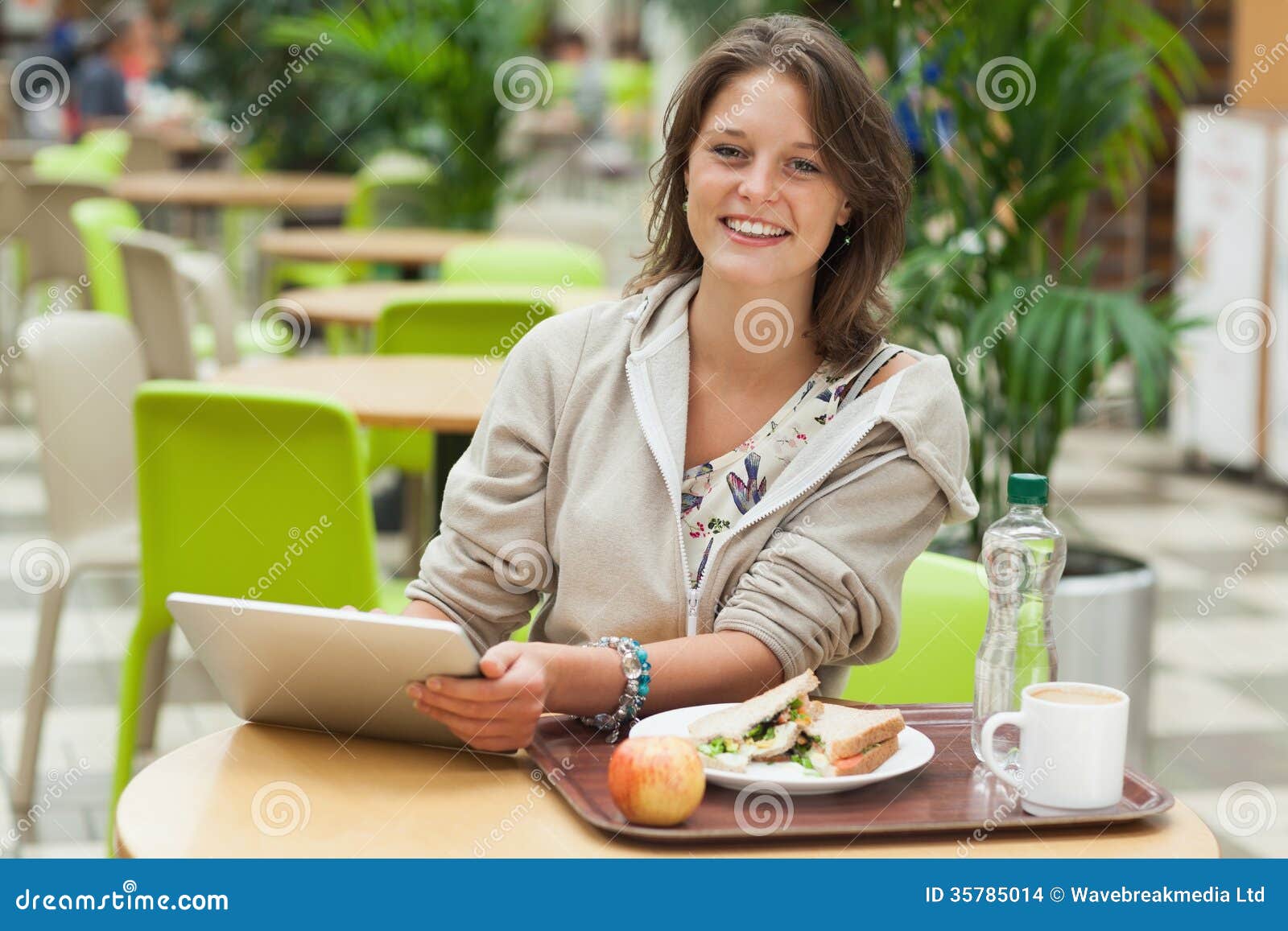 Woman with Tablet PC and Meal in Cafeteria Stock Photo - Image of ...