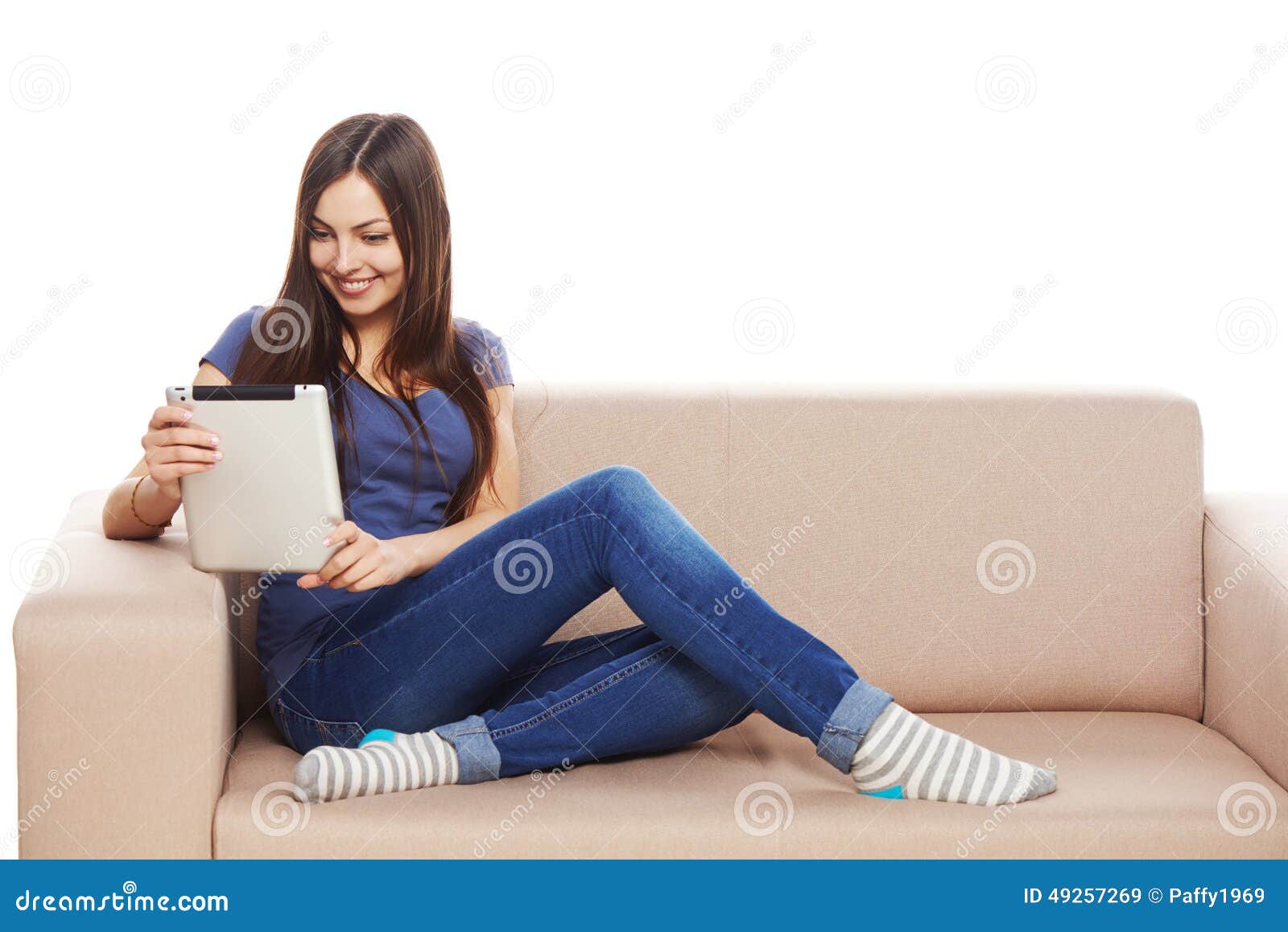 Woman with tablet on sofa stock image. Image of electronics - 49257269