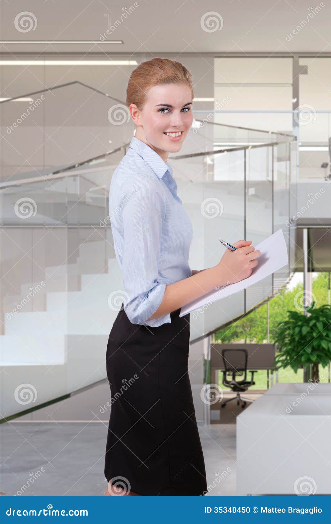 Woman take note in office stock photo. Image of buildings - 35340450