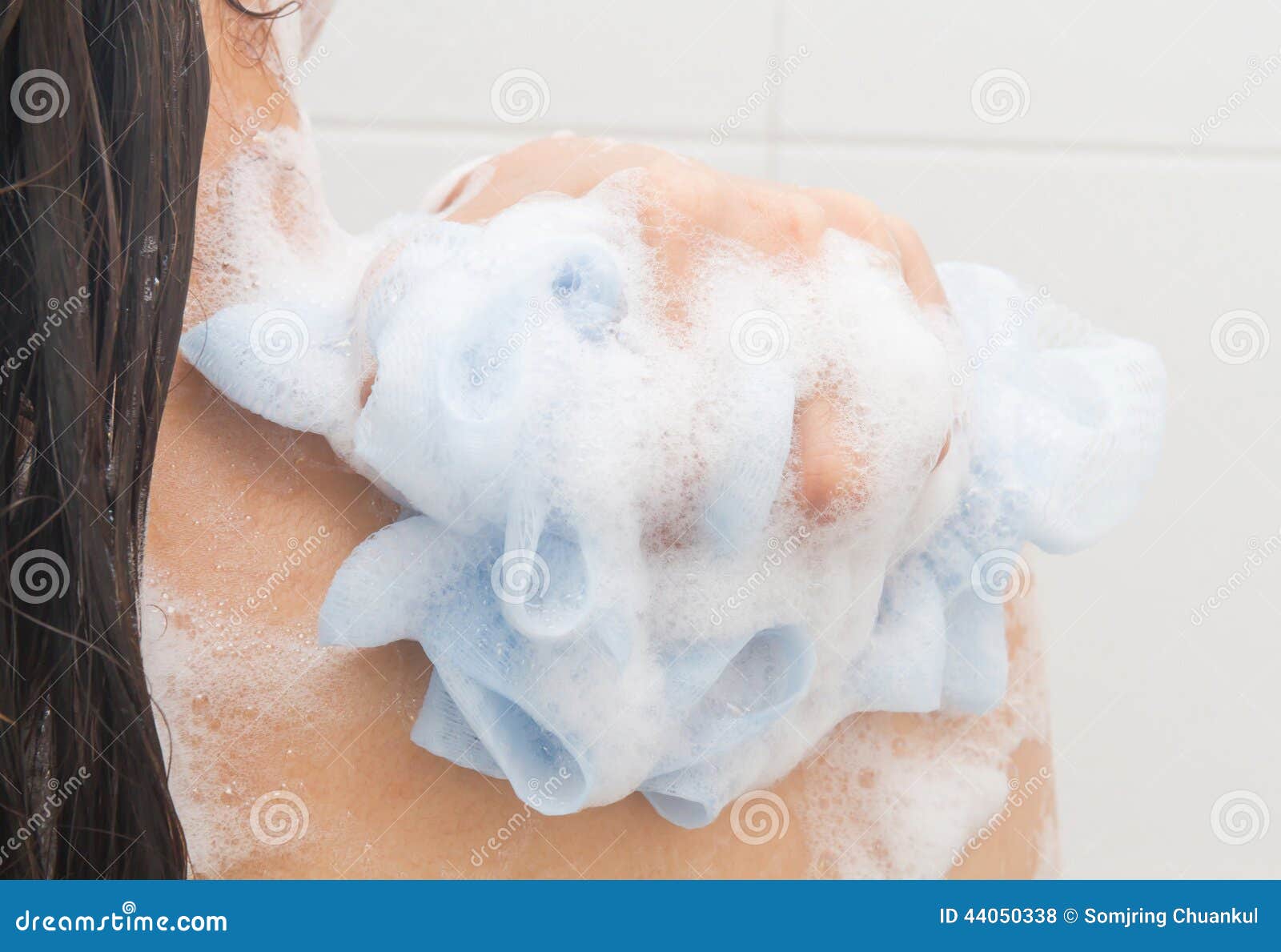 A Woman Take a Shower and Clean Her Back. Stock Photo - Image of ...