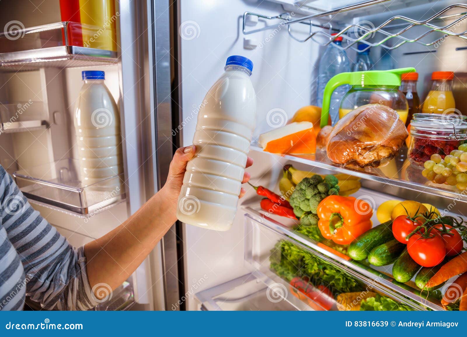 Woman Takes the Milk from the Open Refrigerator Stock Image - Image of ...