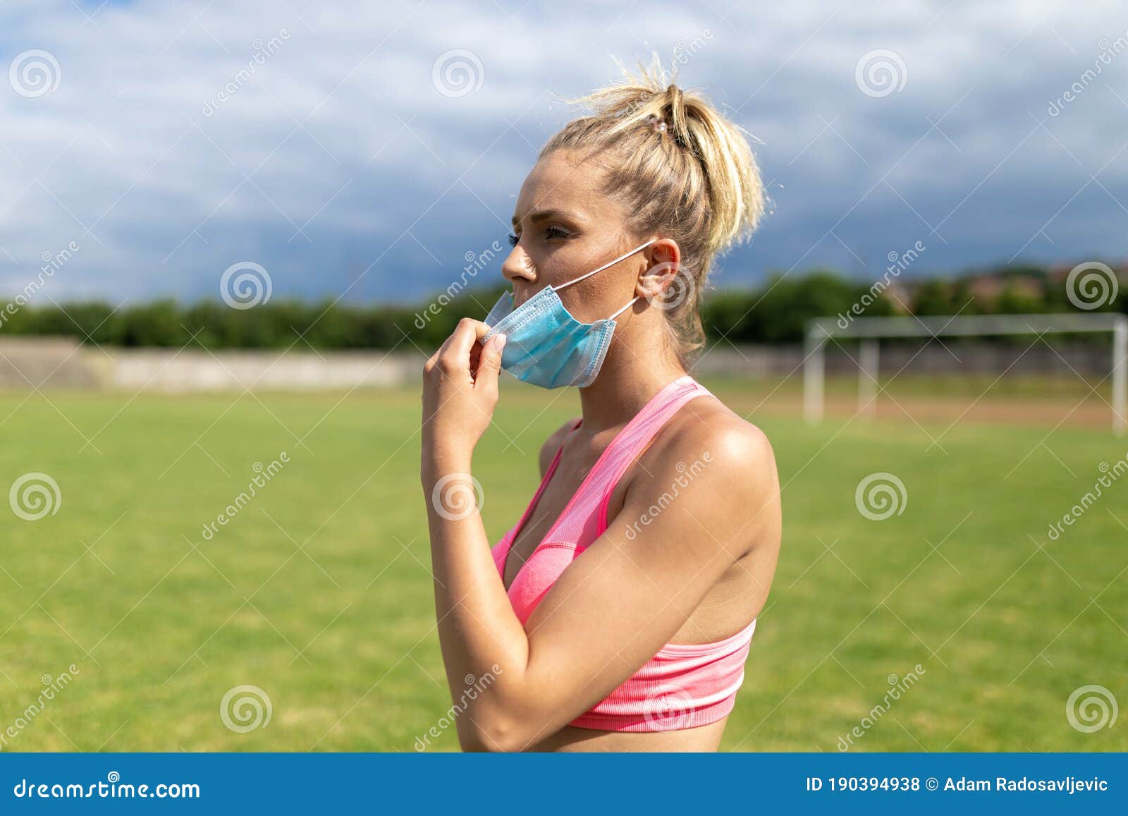 Woman Takes Off Medical Facemask After Outdoor Training Or Running