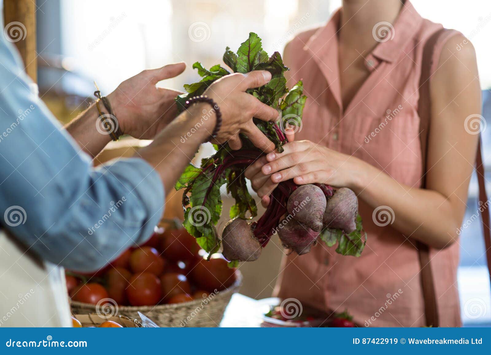 Woman Taking Beetroot from the Vendor at the Grocery Store Stock Image ...