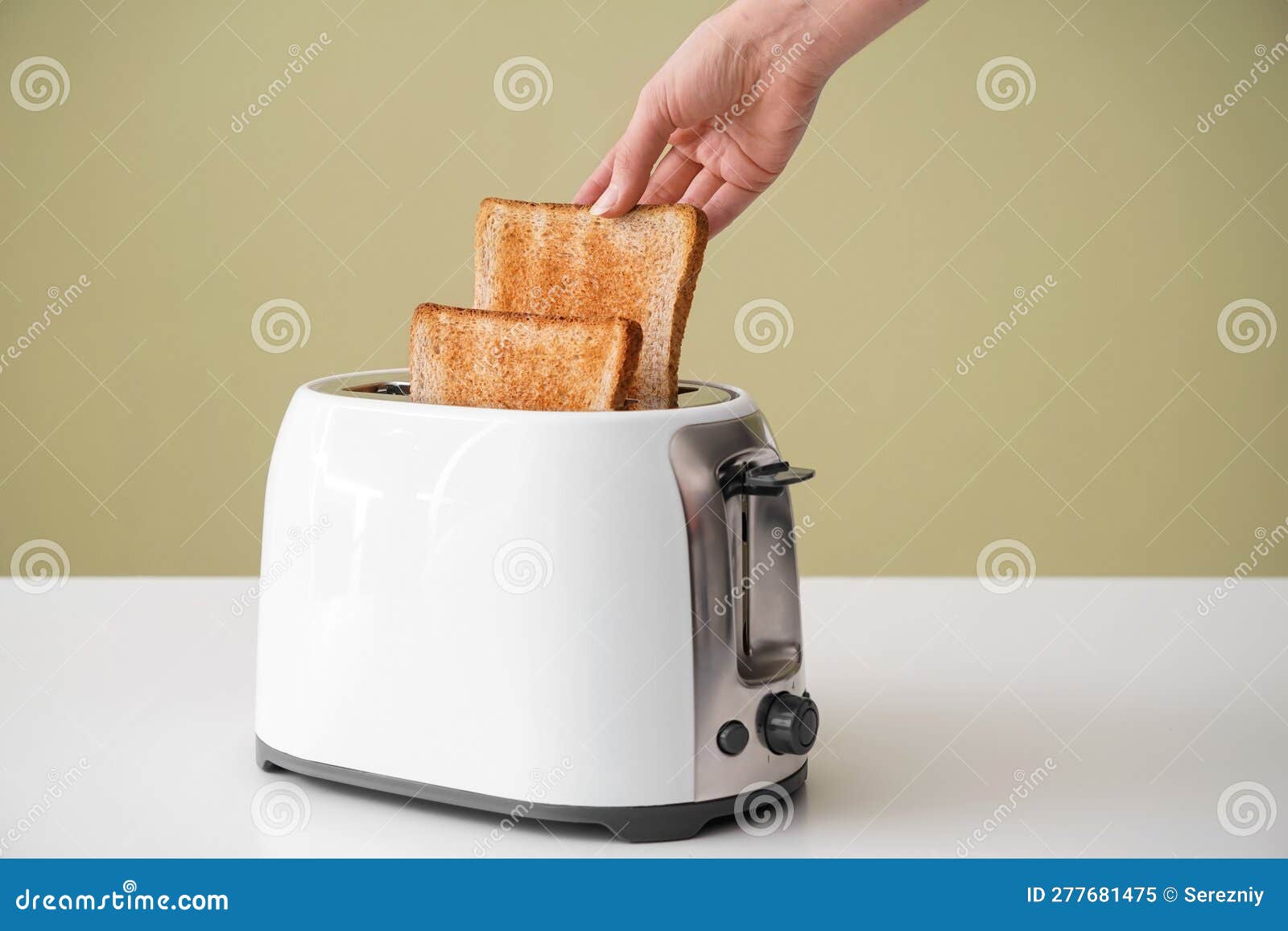 Woman Taking Bread Slice from Toaster on Table Stock Image - Image of ...