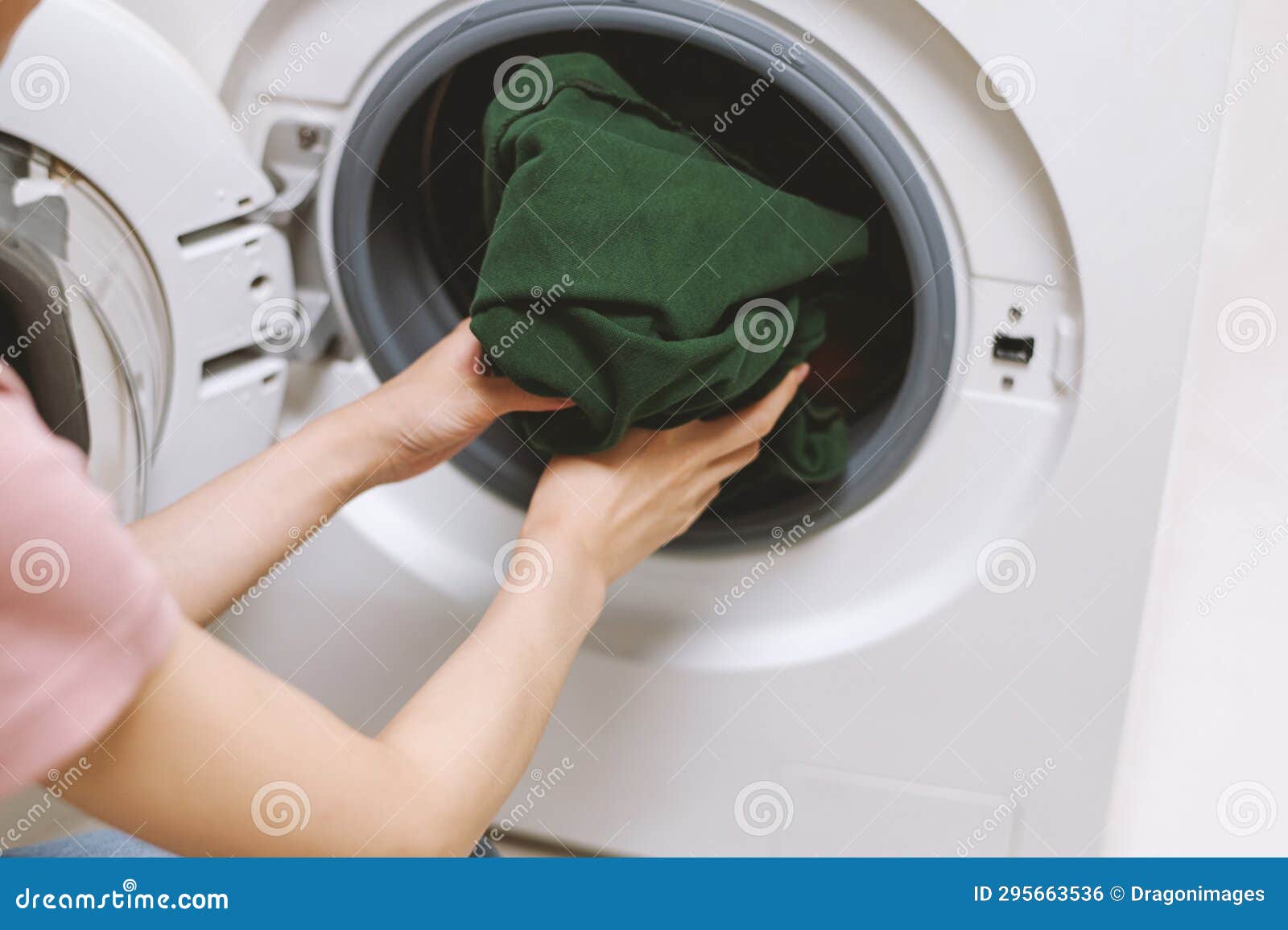 Woman Taking Clothes Out of Washing Machine Stock Photo - Image of ...