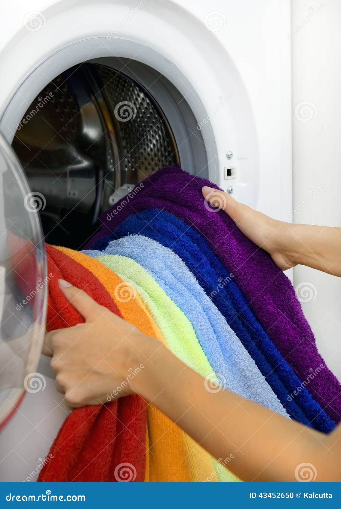 Woman Taking Color Laundry from Washing Machine Stock Photo - Image of ...