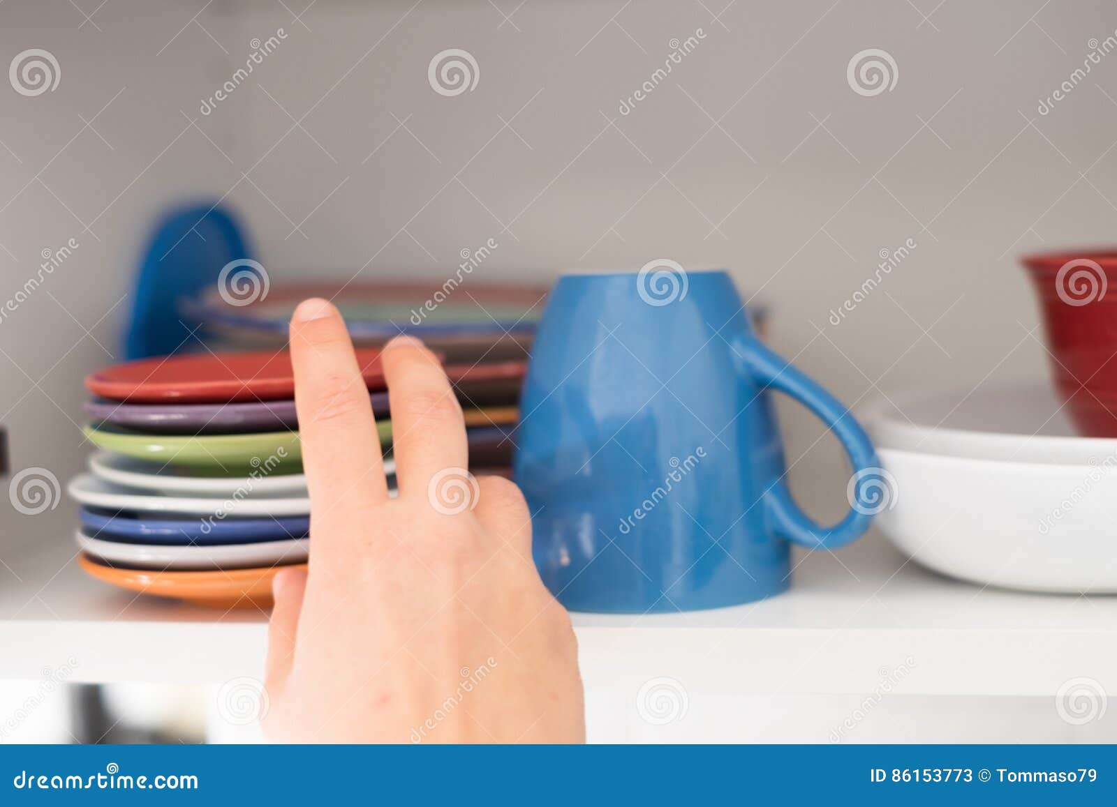 Woman Taking a Cup from a Kitchen Cabinet for Breakfast Stock Image ...