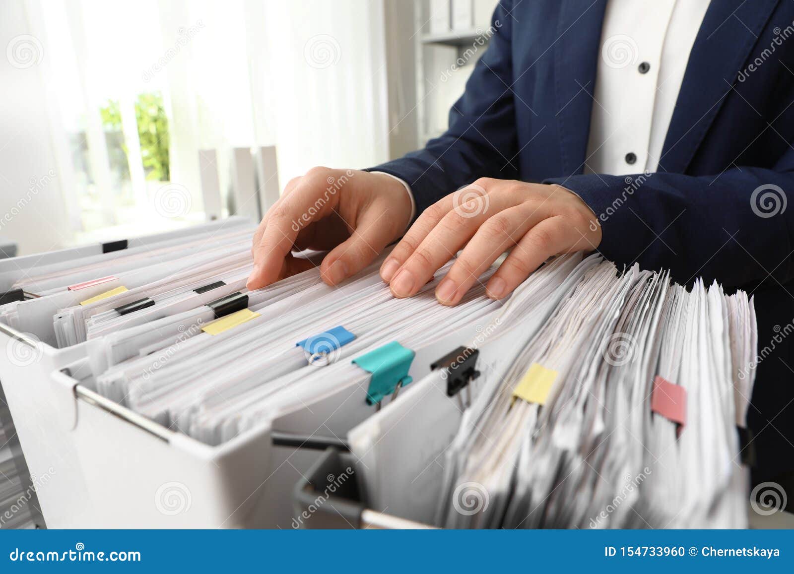 Woman Taking Documents from Folder in Archive, Stock Photo - Image of ...