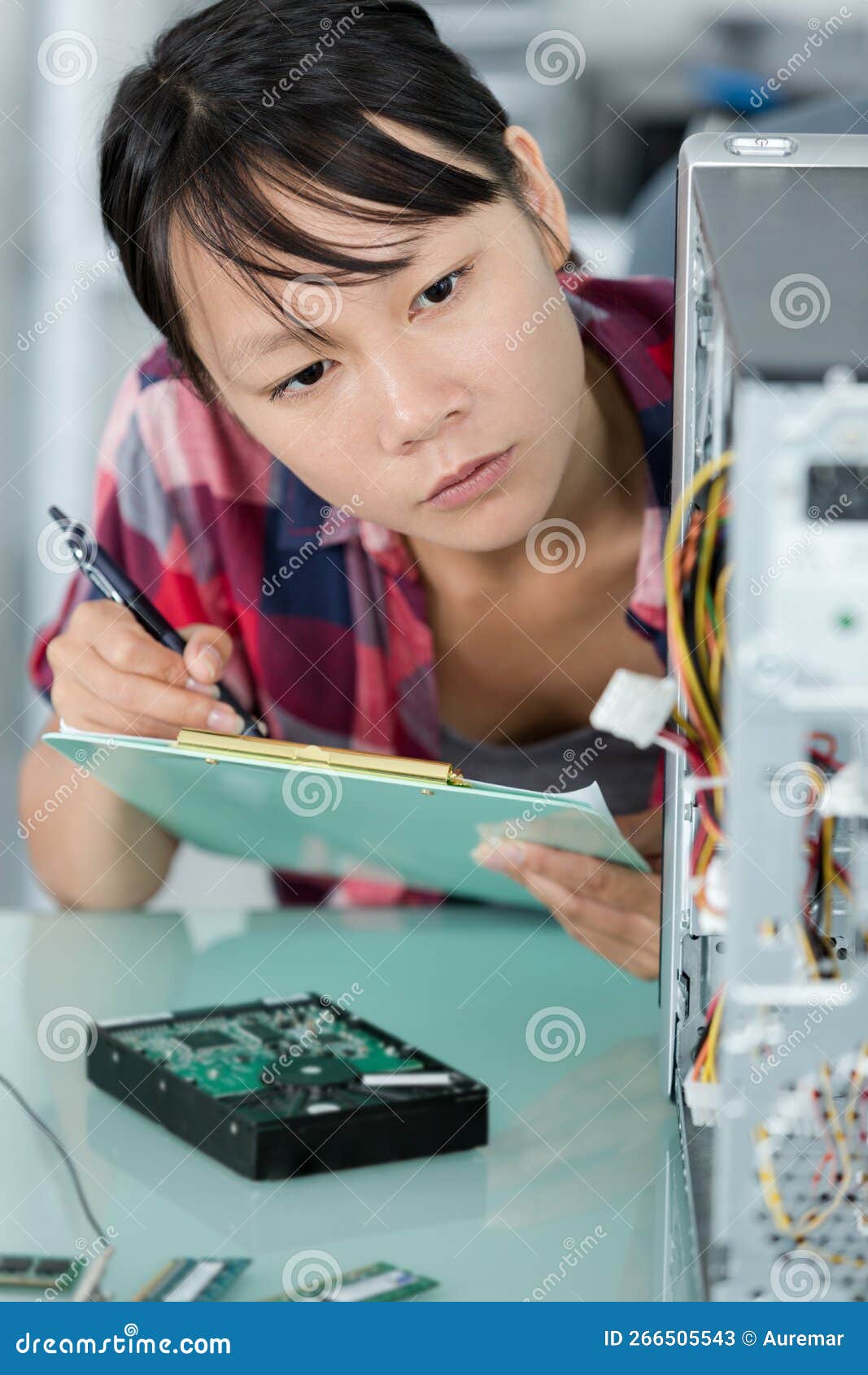 Woman Taking Notes while Fixing Pc Stock Image - Image of support ...